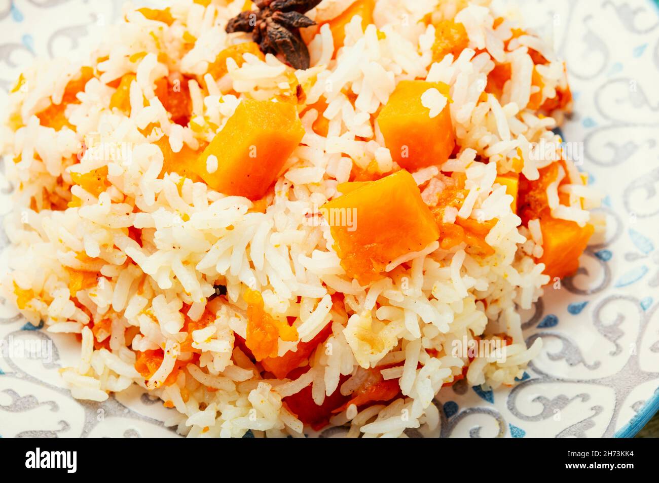 Vegetable pilaf on a plate, rice with pumpkin Stock Photo - Alamy