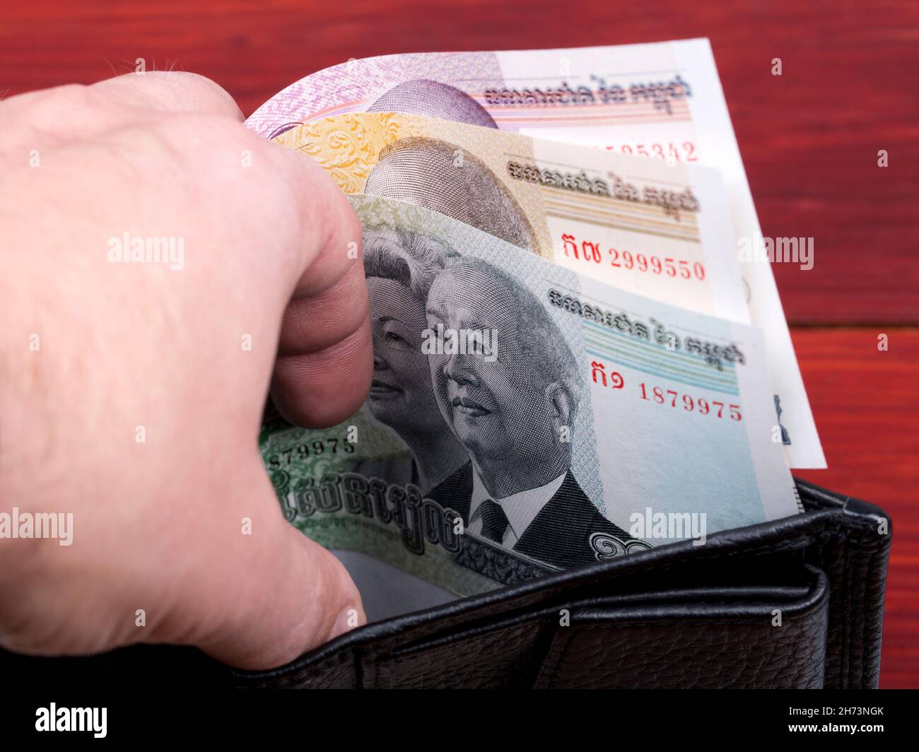 Cambodian money - riel in the black wallet Stock Photo - Alamy
