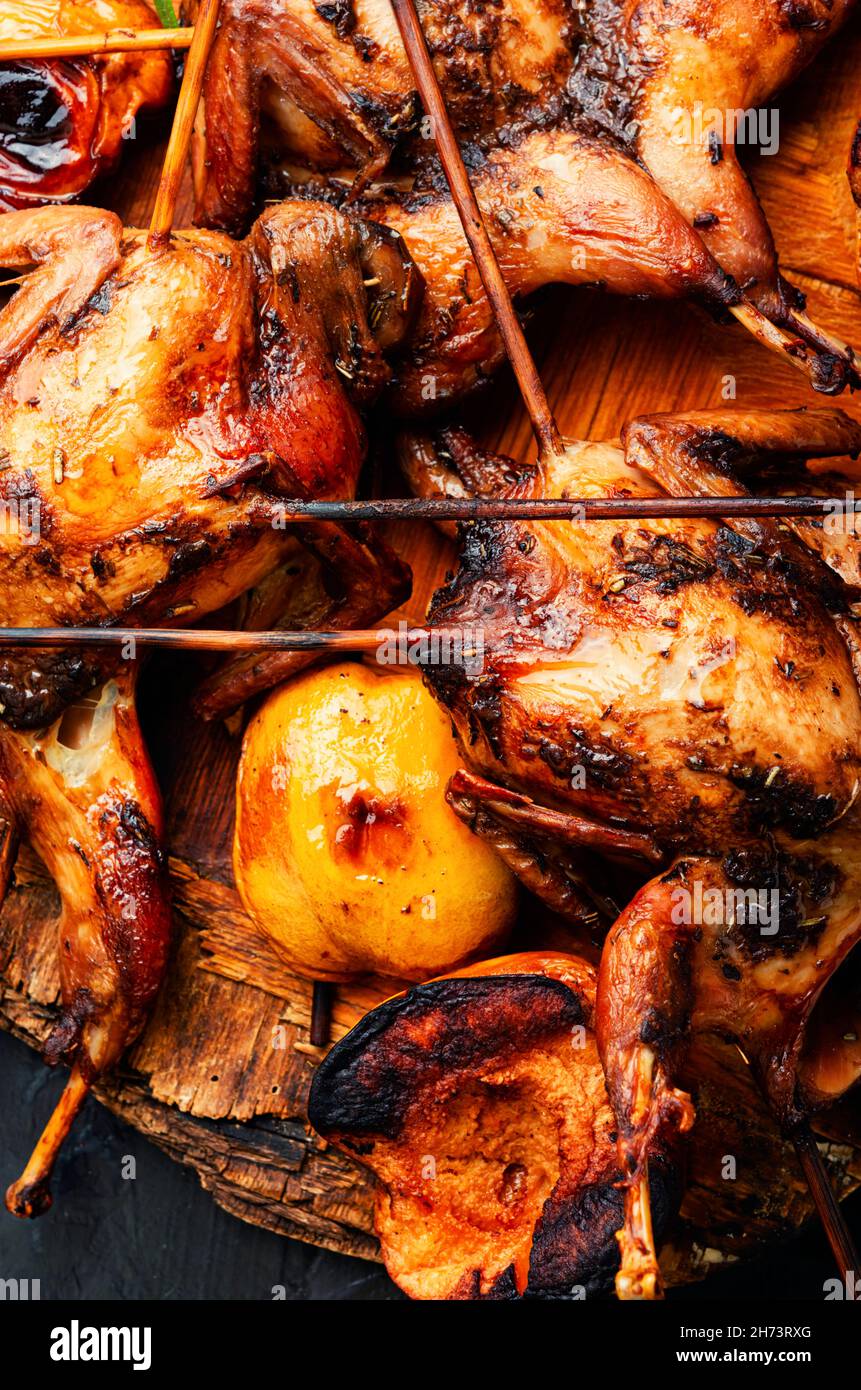 Delicious partridge or quail grilled on skewers.BBQ meat Stock Photo ...