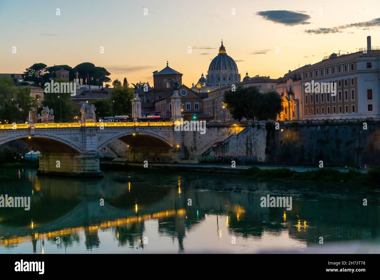 Rome sunset over Tiber and St Peters Basilica Vatican. Iconic landmarks ...