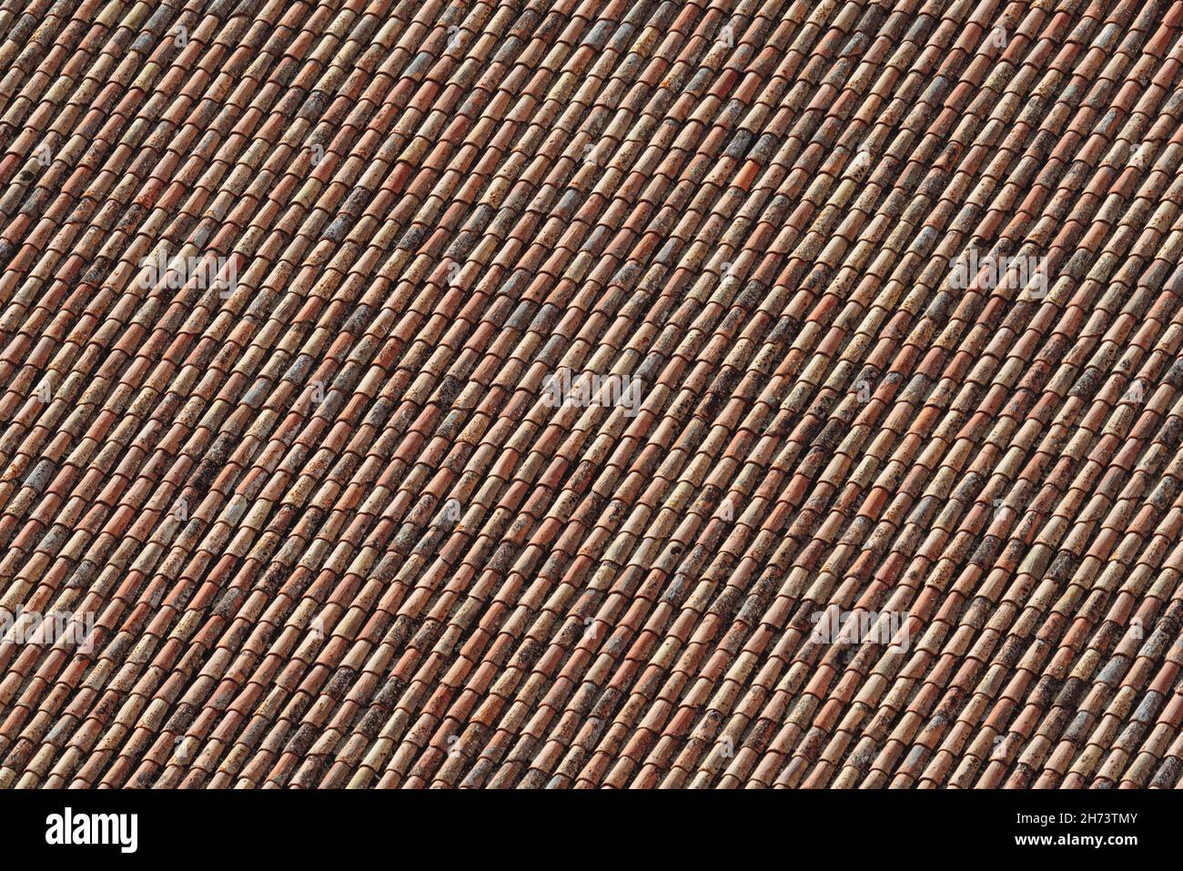 Tile roof background closeup view with sun and shadows Stock Photo - Alamy