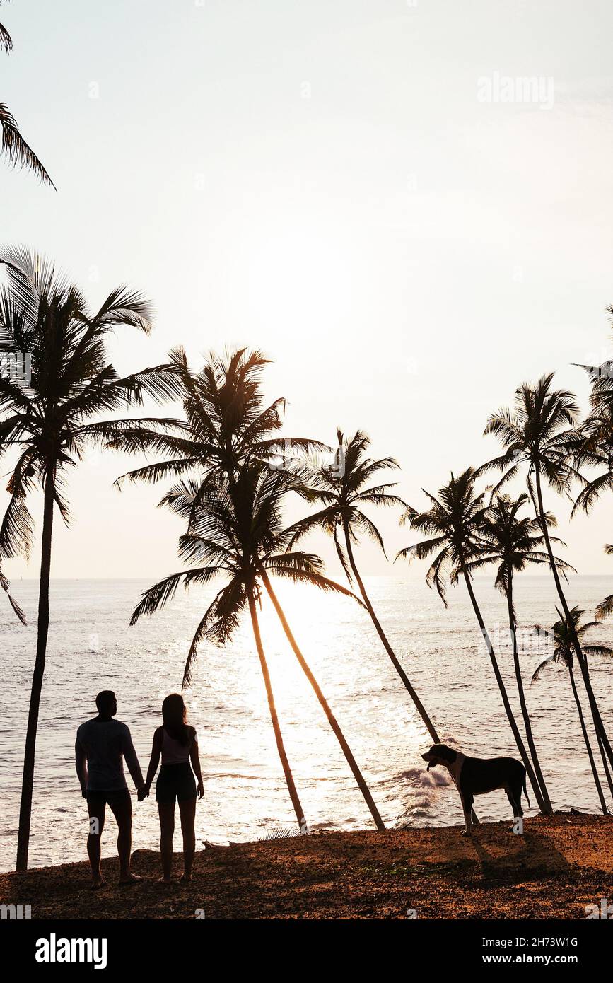 Silhouette of loving couple on sea. A couple in love at sunset. Man and ...