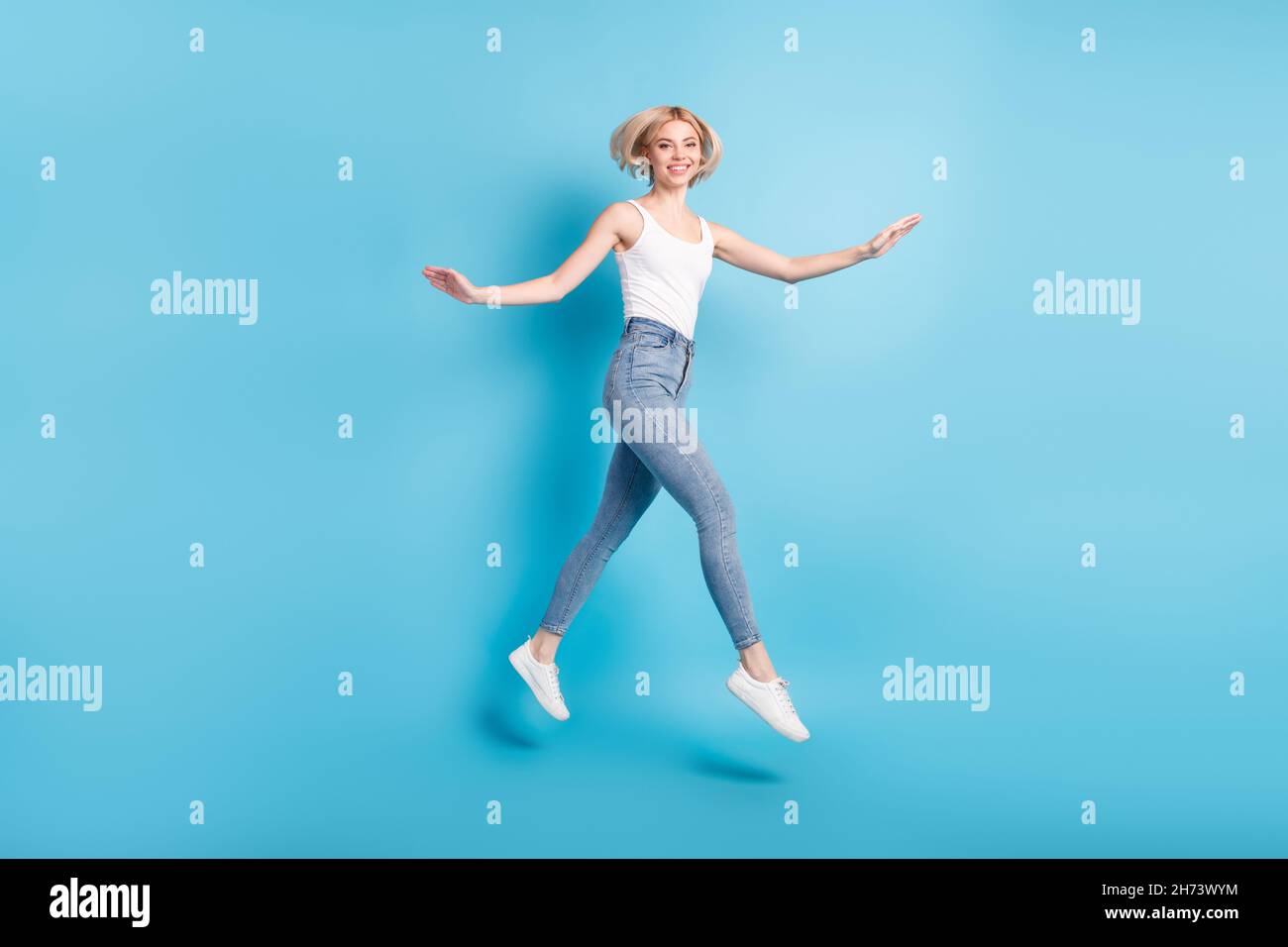 Full body profile side photo of happy young cheerful lady jump up go ...