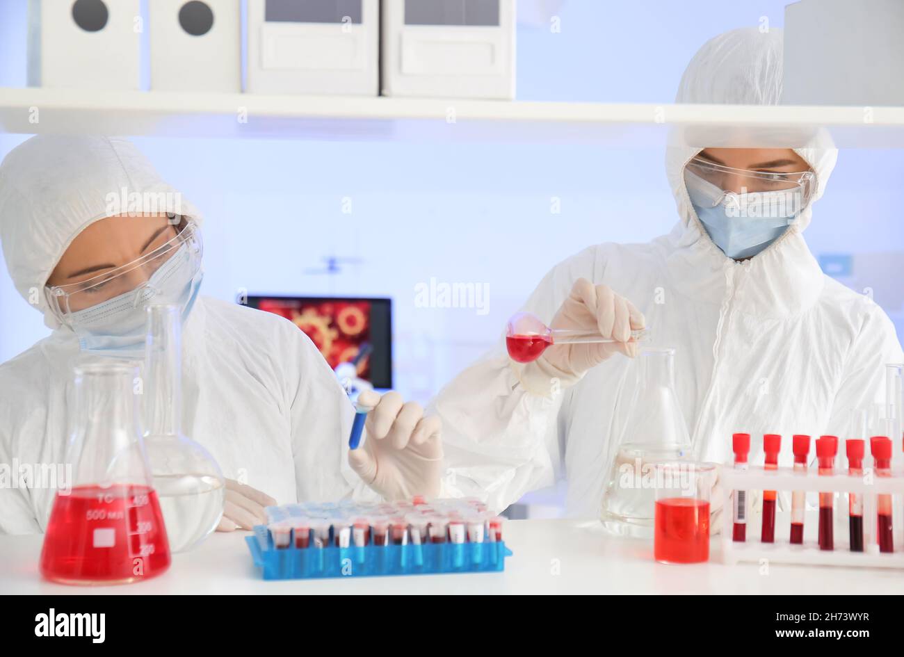 Scientists working with samples in laboratory Stock Photo - Alamy