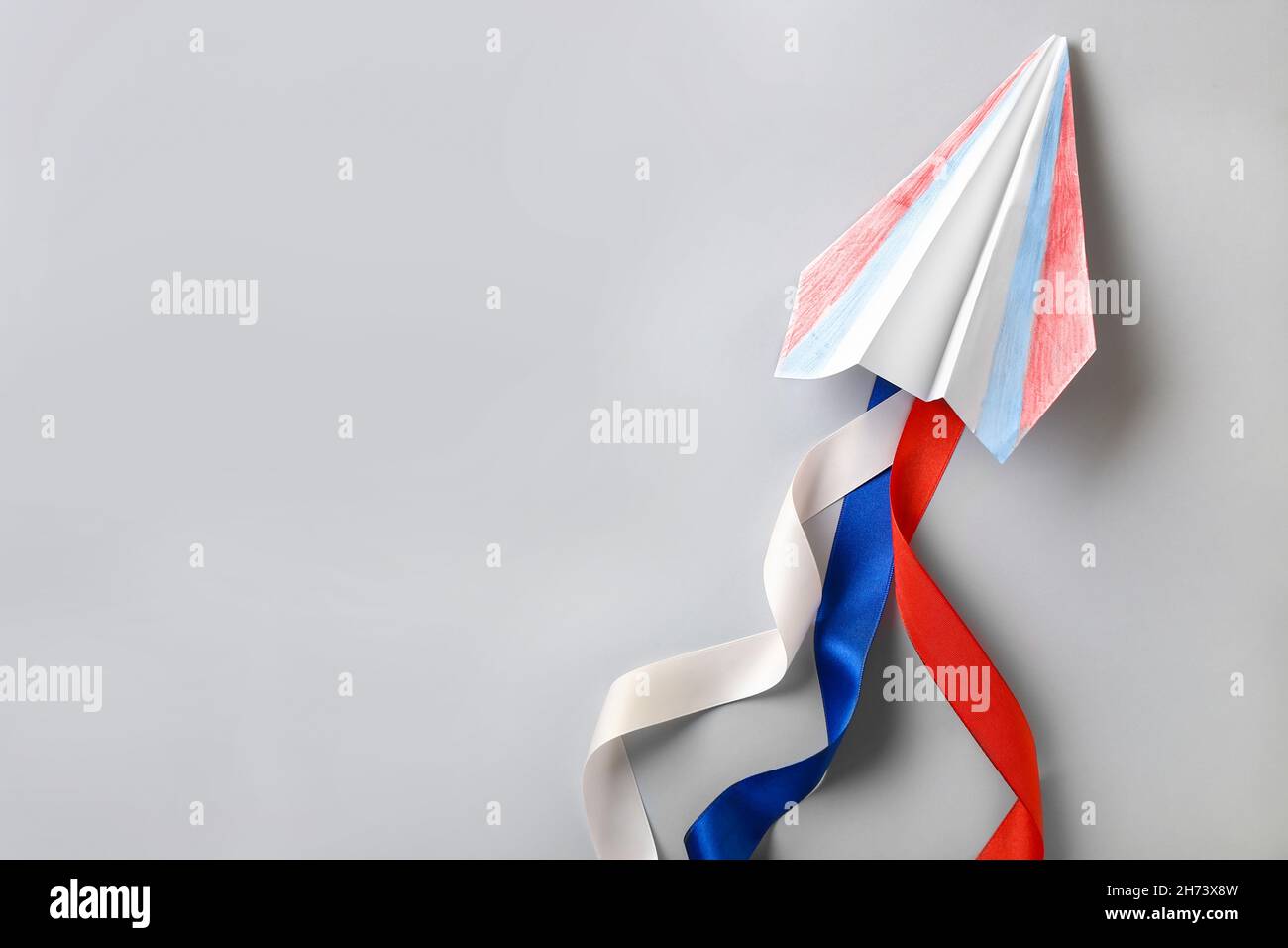 Russian flag concept. Paper plane with ribbons on grey background Stock ...