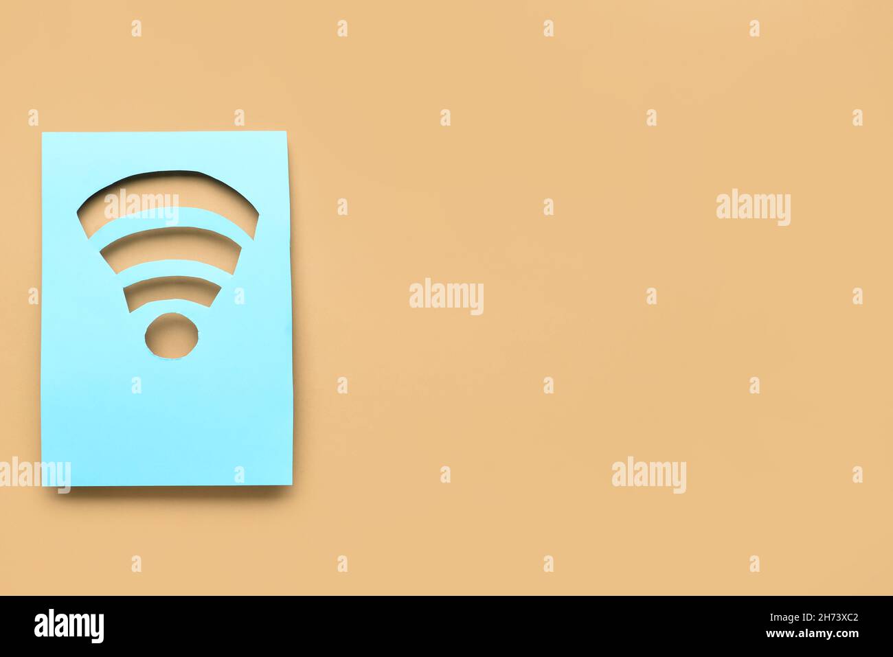 WiFi symbol made from paper on beige background Stock Photo - Alamy