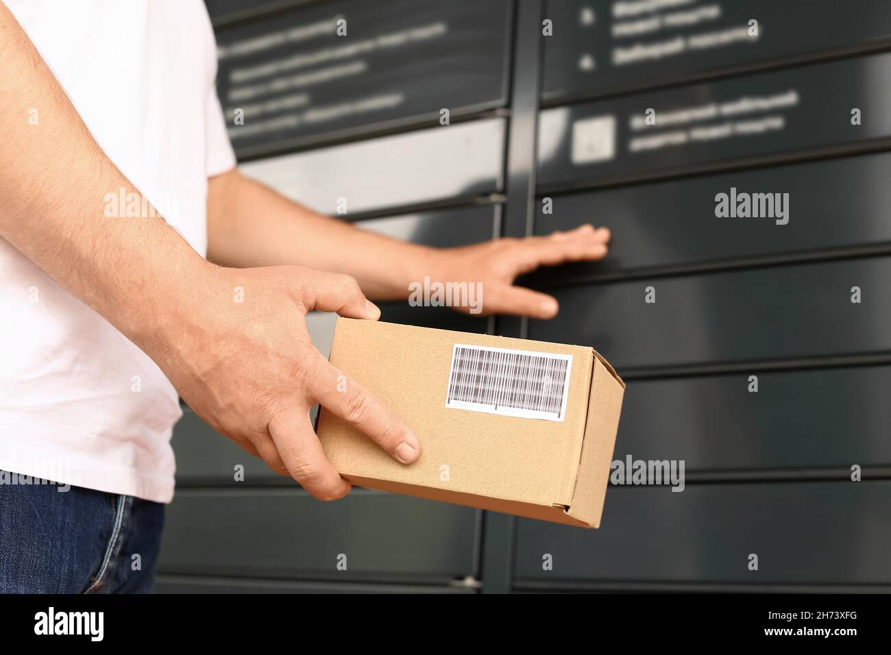 Client using automated self service post terminal machine Stock Photo ...