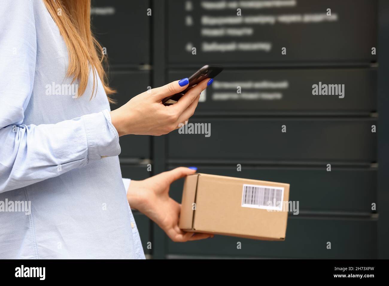Client using automated self service post terminal machine Stock Photo ...