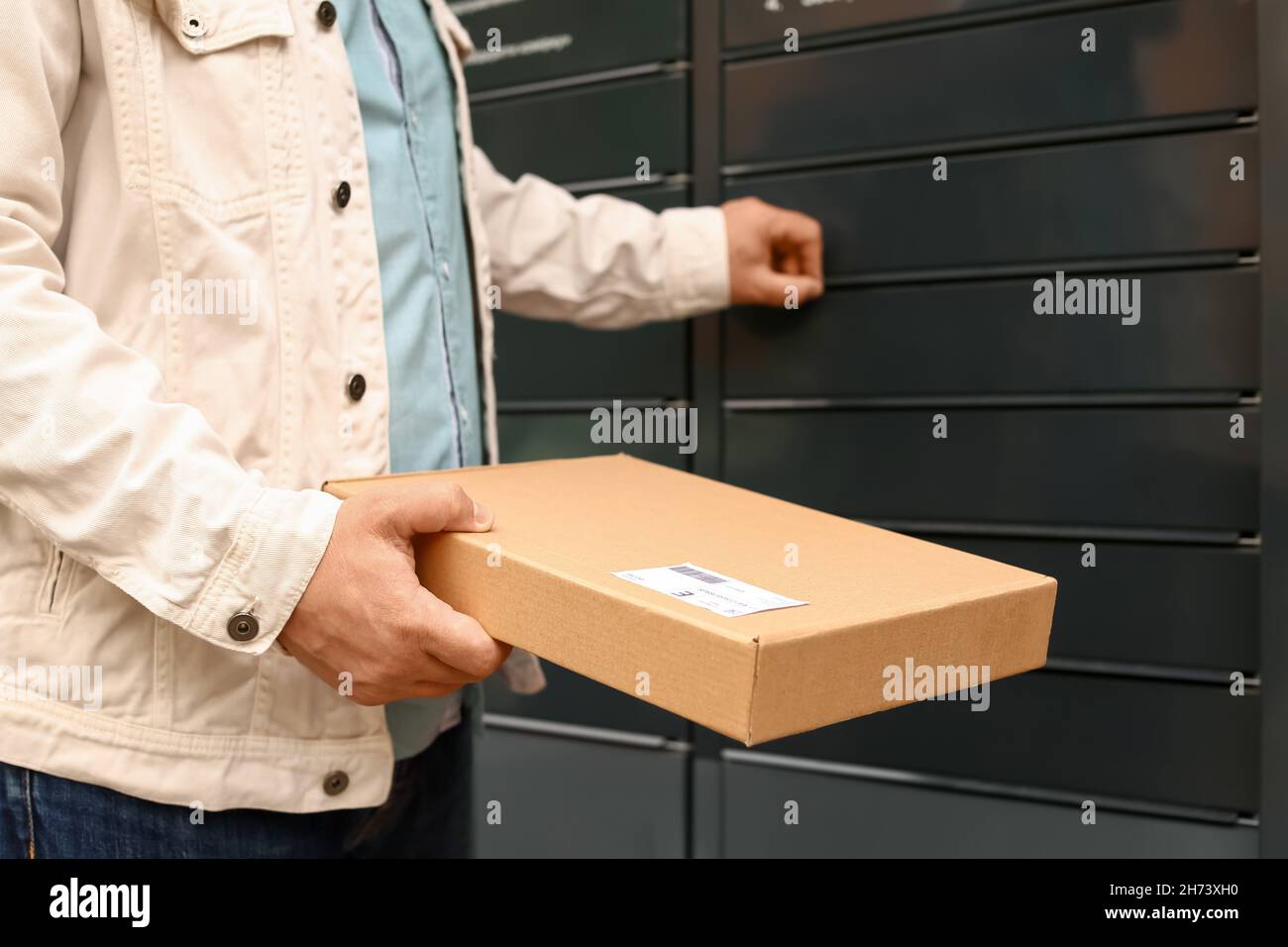 Client using automated self service post terminal machine Stock Photo ...