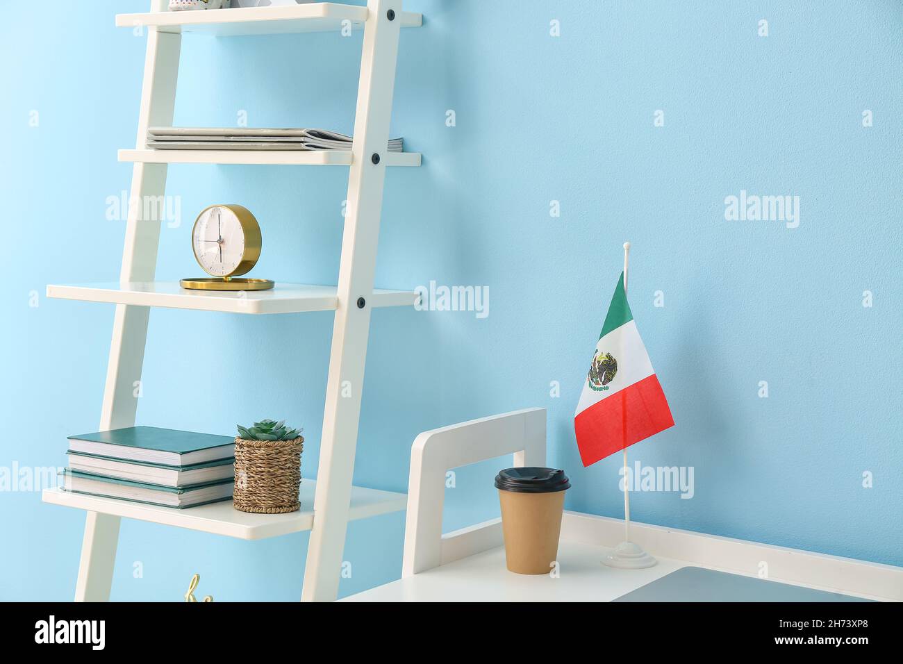 Mexican flag on table in room Stock Photo - Alamy