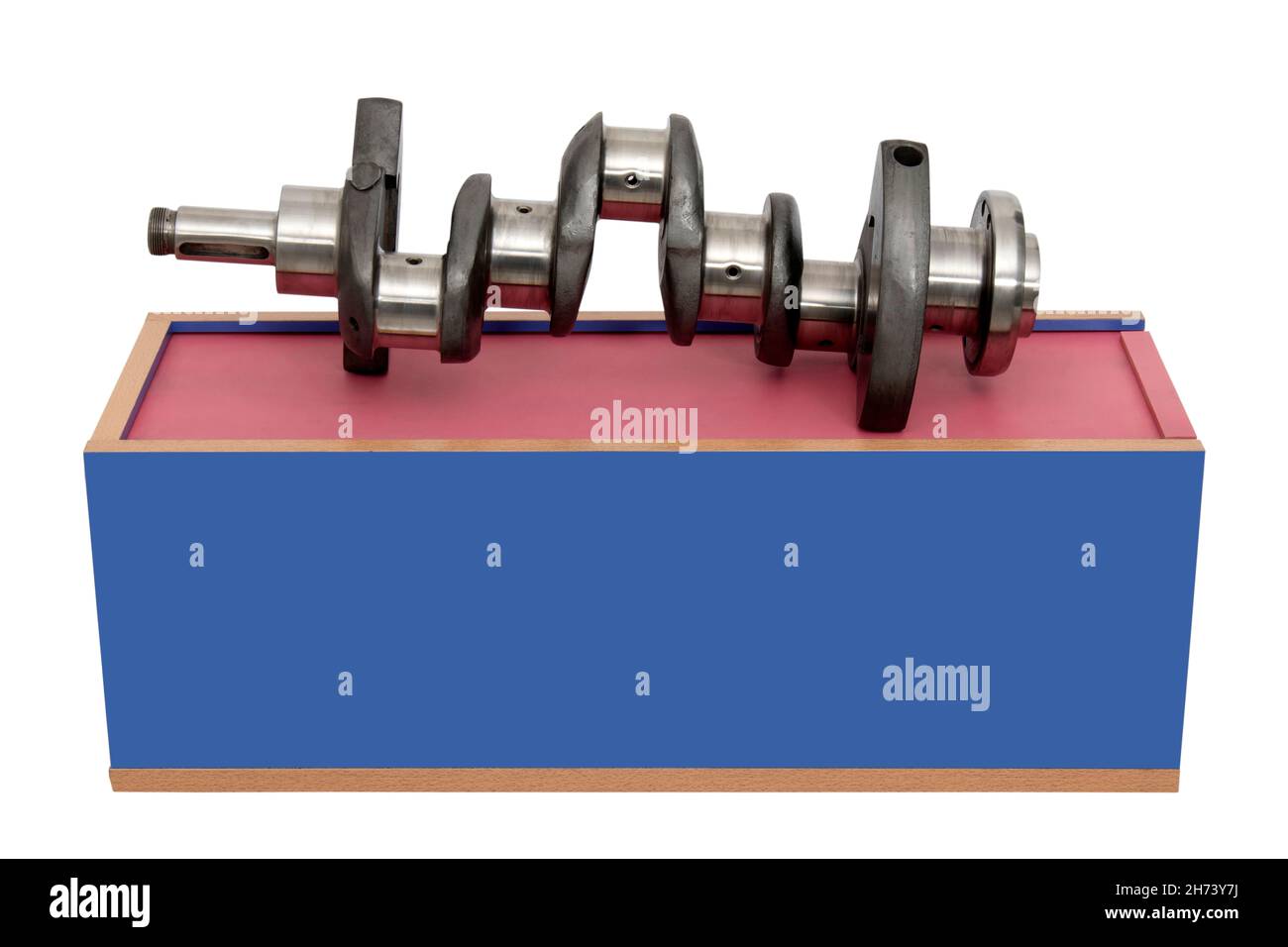 Crankshaft with wooden box. Industrial background Stock Photo - Alamy