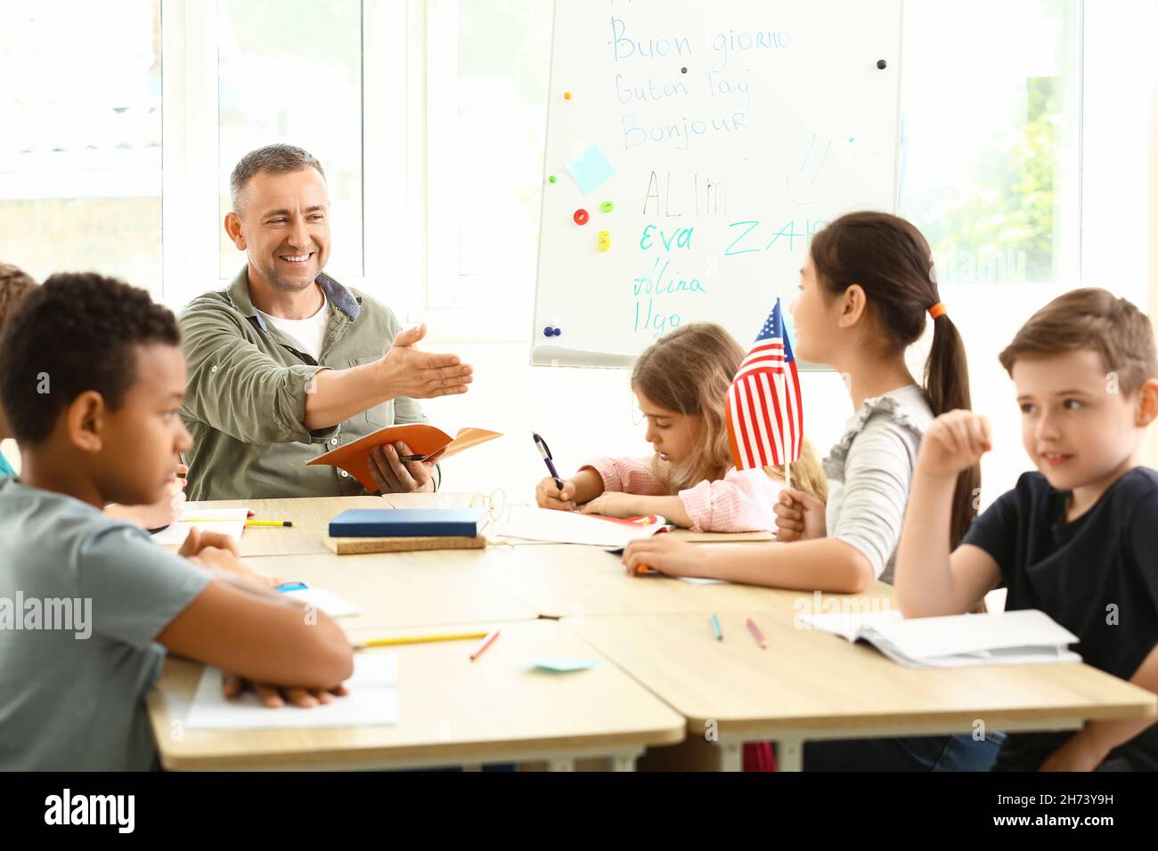 American school children teacher flag hi-res stock photography and images - Alamy
