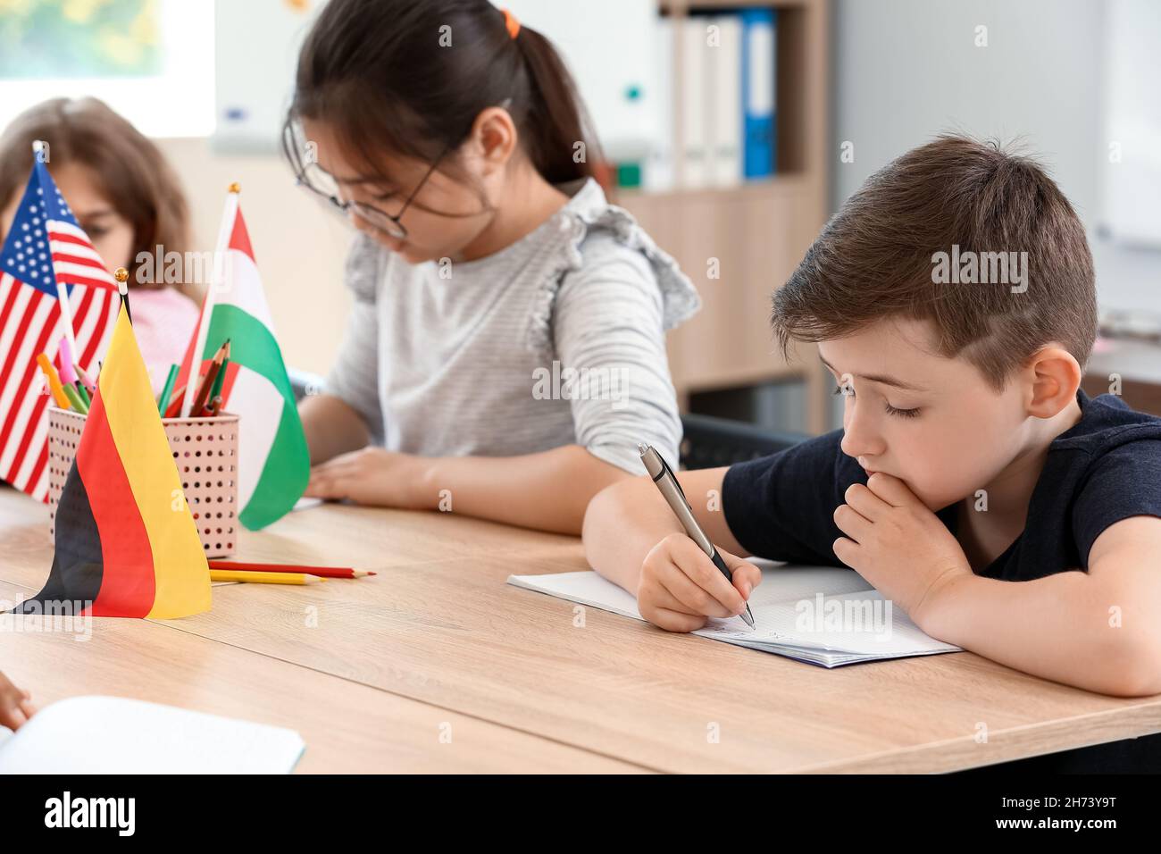 Children taking classes at language school Stock Photo - Alamy