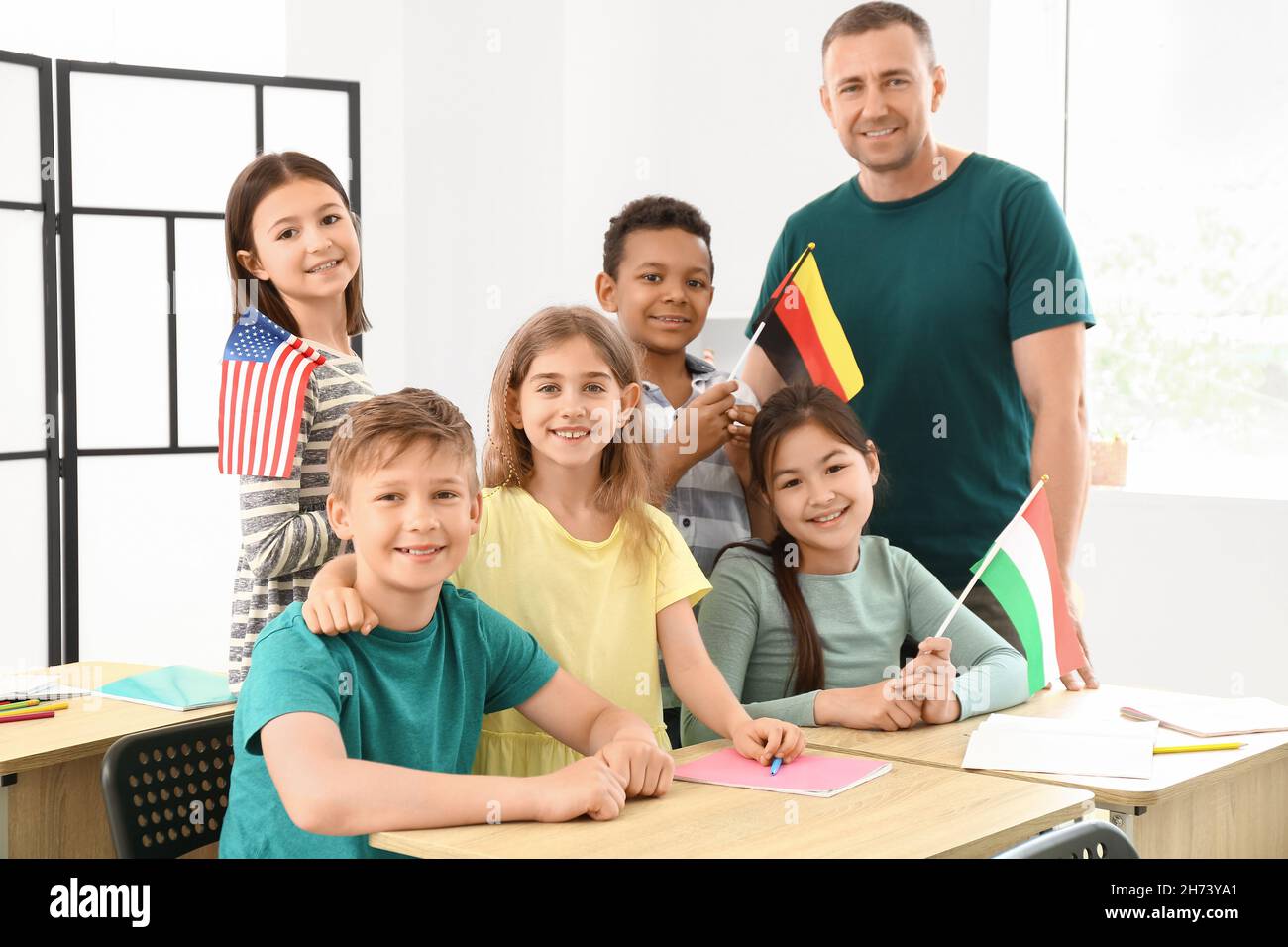 Pupils and teacher during lesson at language school Stock Photo - Alamy
