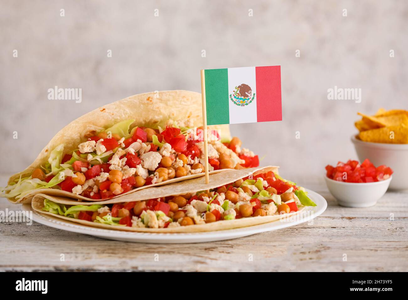 Mexican traditional food decorated with flag on light background Stock ...