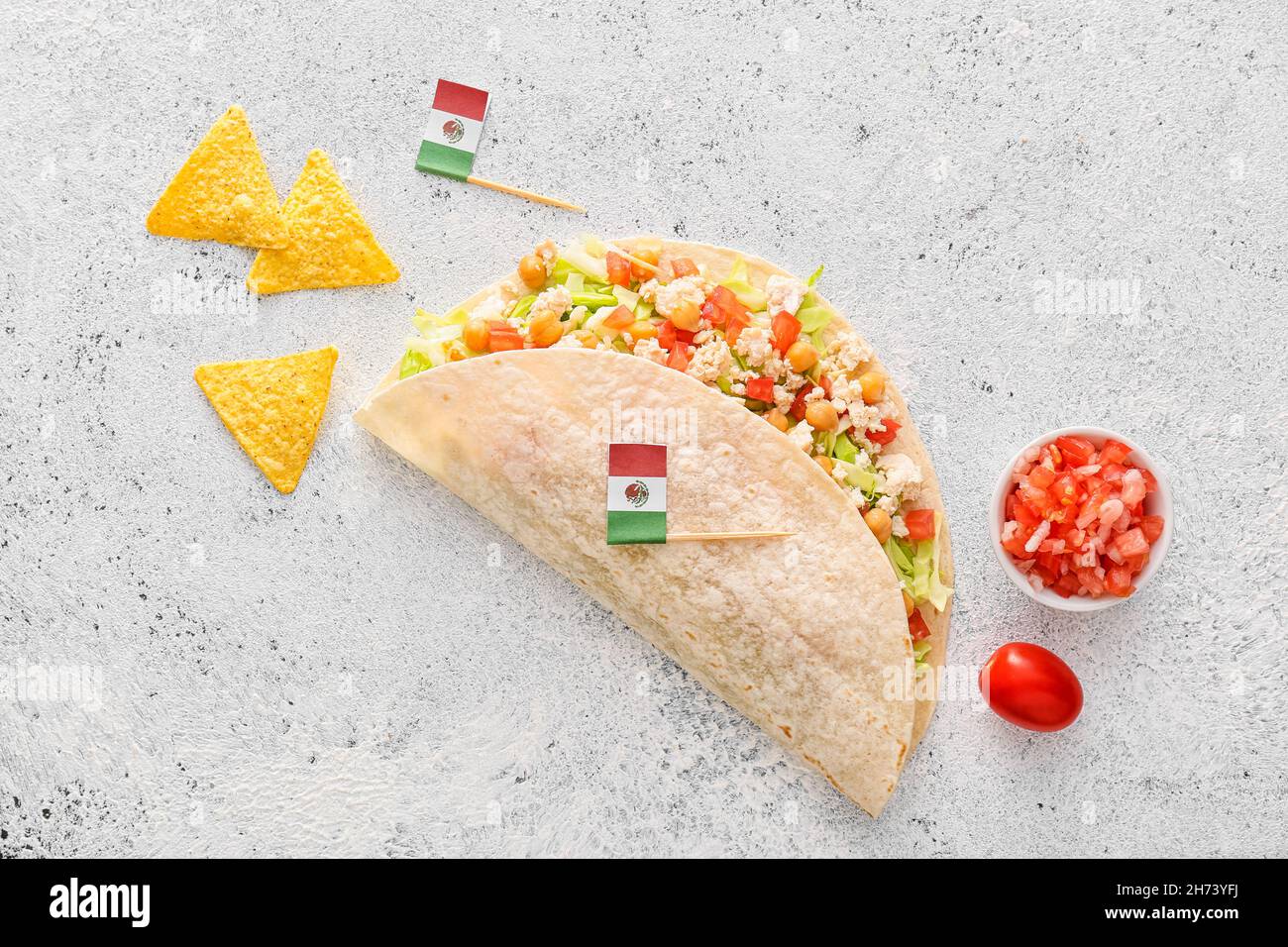 Mexican traditional taco on light background Stock Photo - Alamy