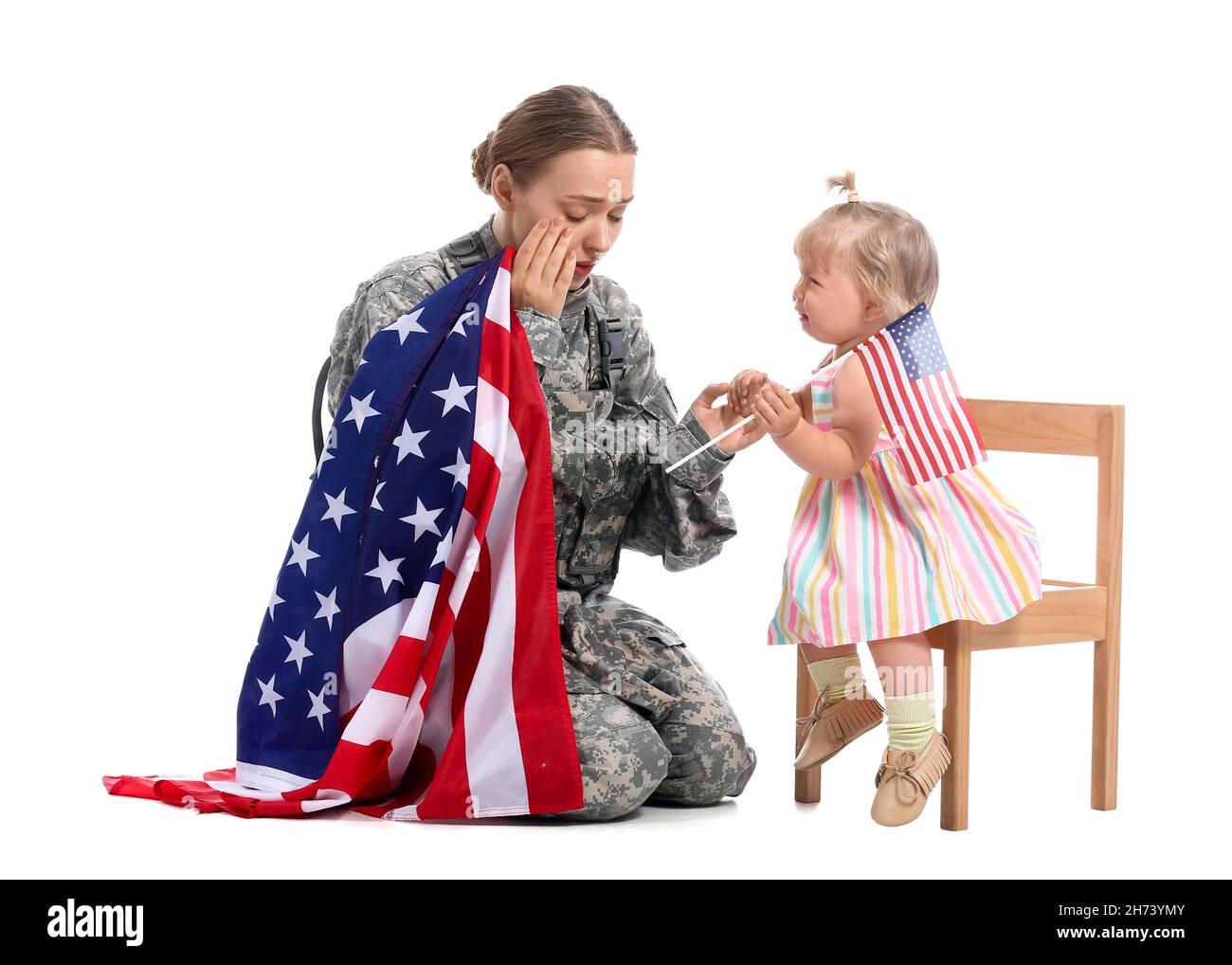 Female soldier with USA flag and her baby girl crying on white ...