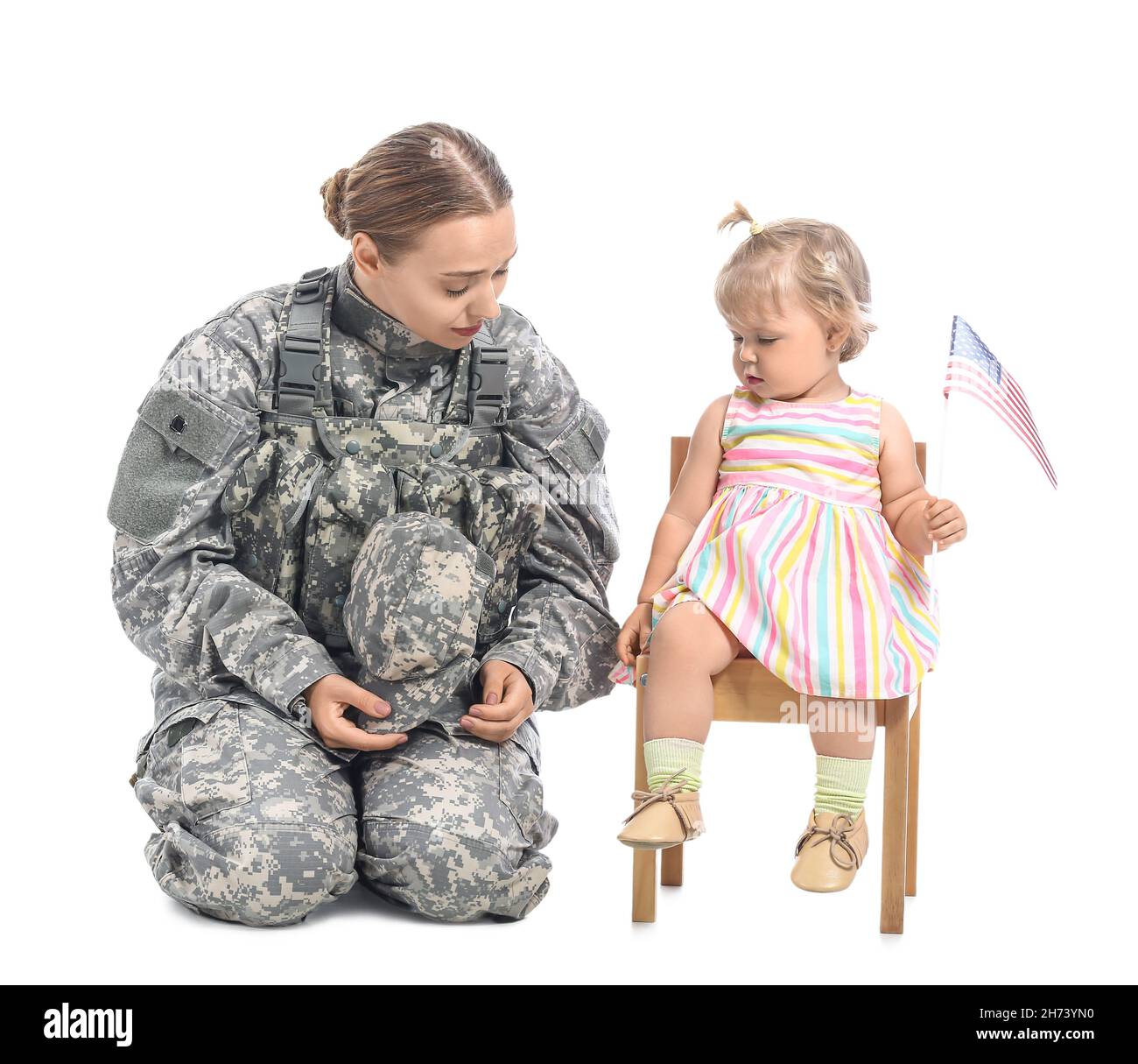 Female soldier with her baby girl and USA flag on white background ...