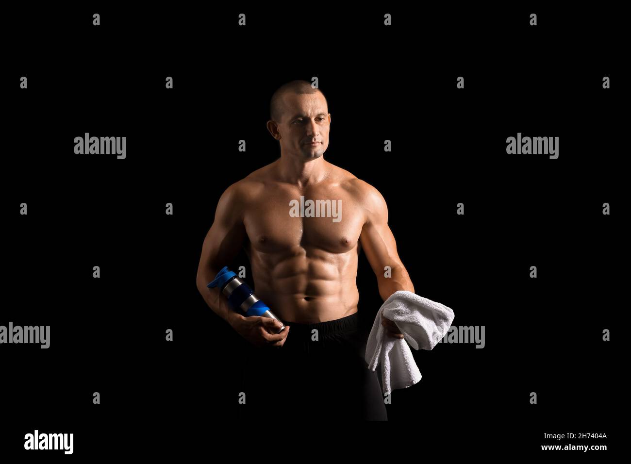 Male bodybuilder with protein shake on dark background Stock Photo - Alamy