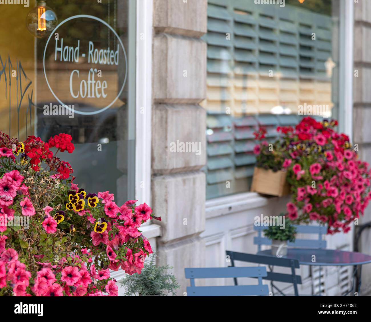 LONDON, UK - JULY 23, 2021: Pretty window boxes outside Cafe with Hand ...