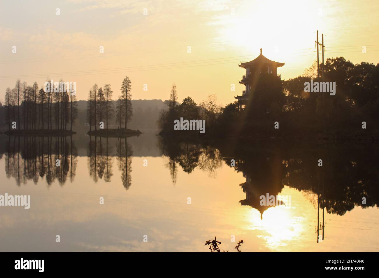 Beautiful landscape with the Chinese tower at sunset Stock Photo - Alamy