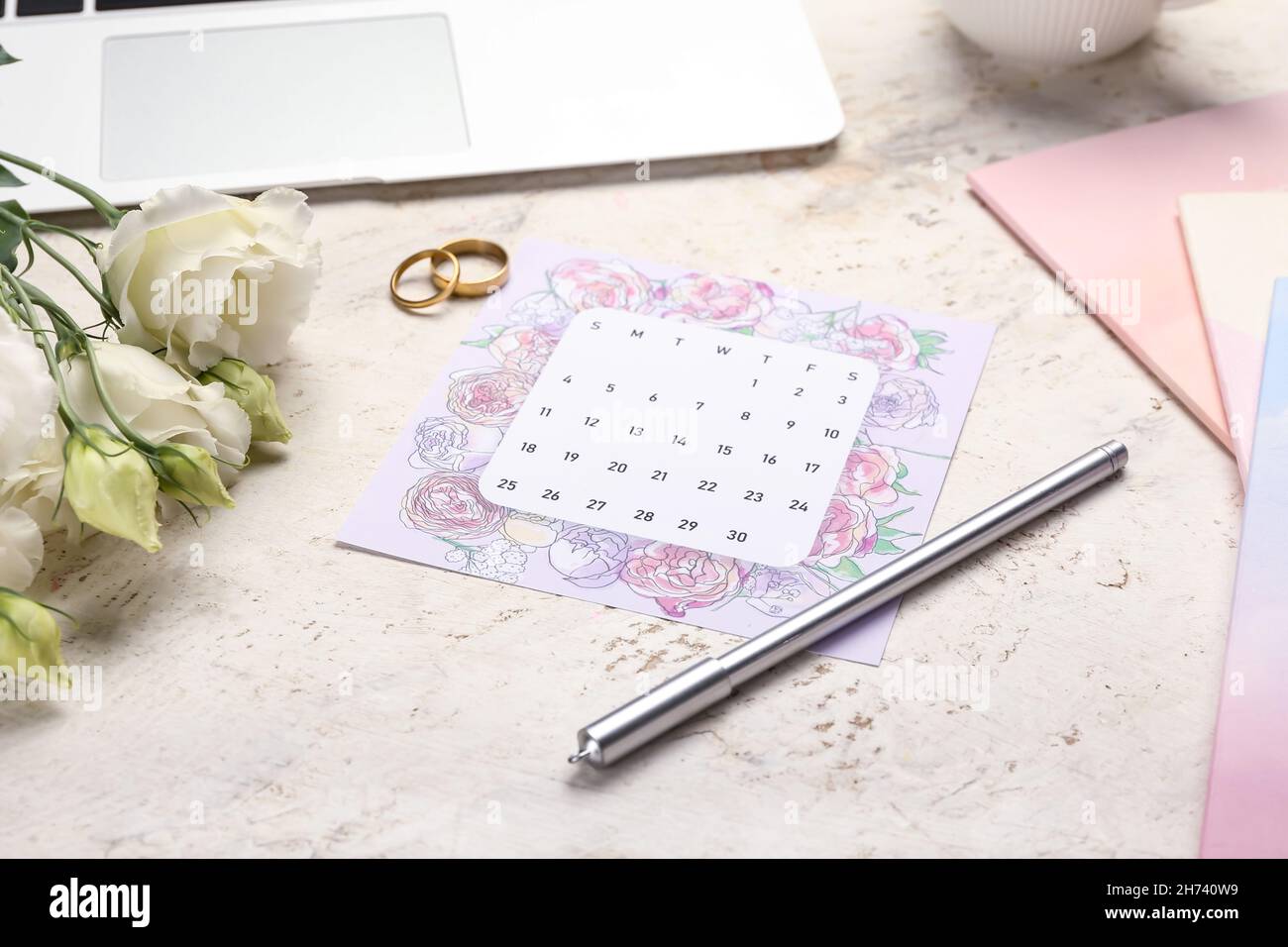 Beautiful composition with wedding calendar on table Stock Photo - Alamy