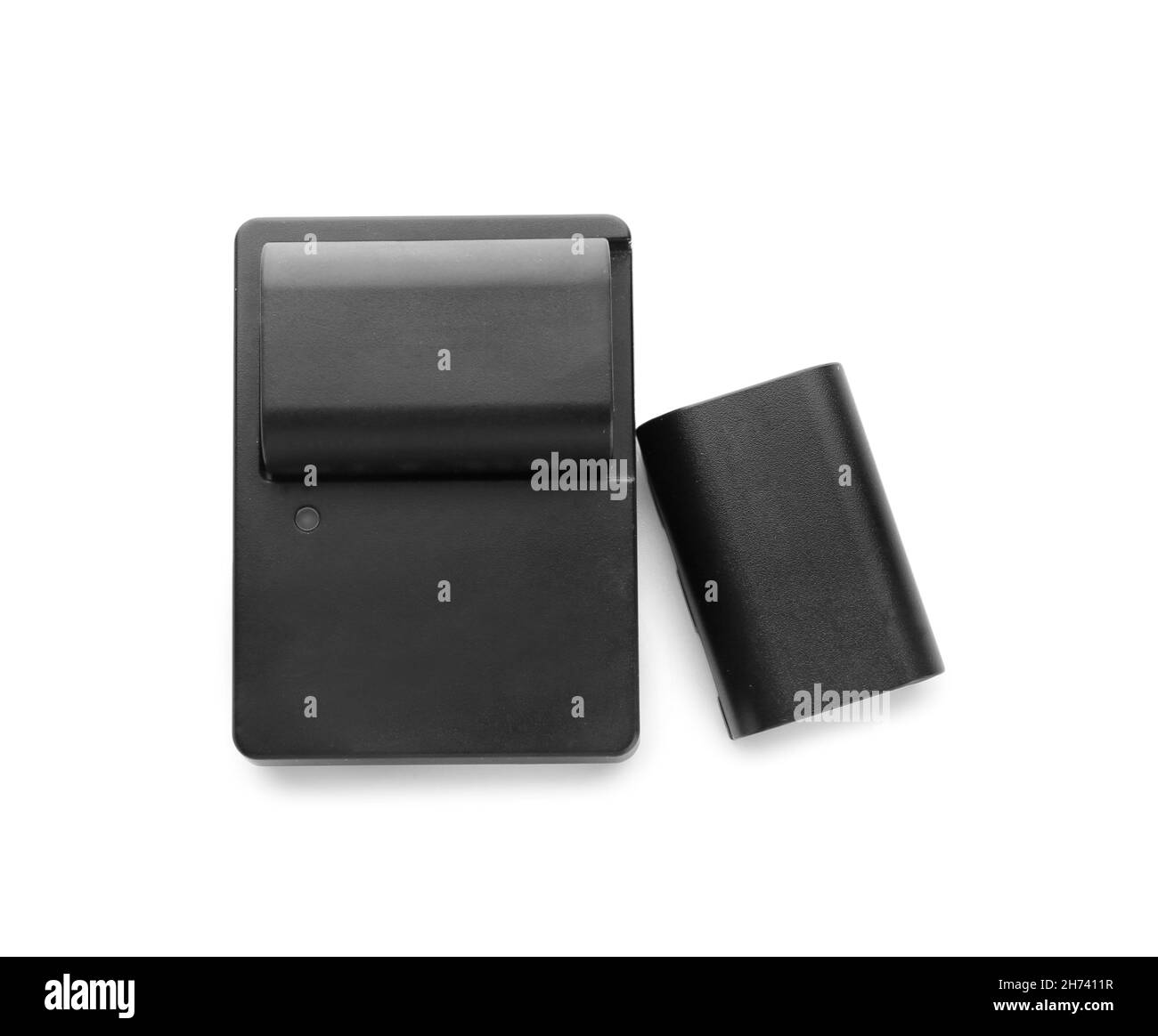Camera batteries and charger isolated on white background Stock Photo ...