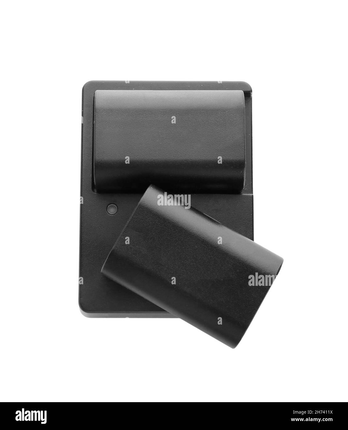 Camera batteries and charger isolated on white background Stock Photo ...