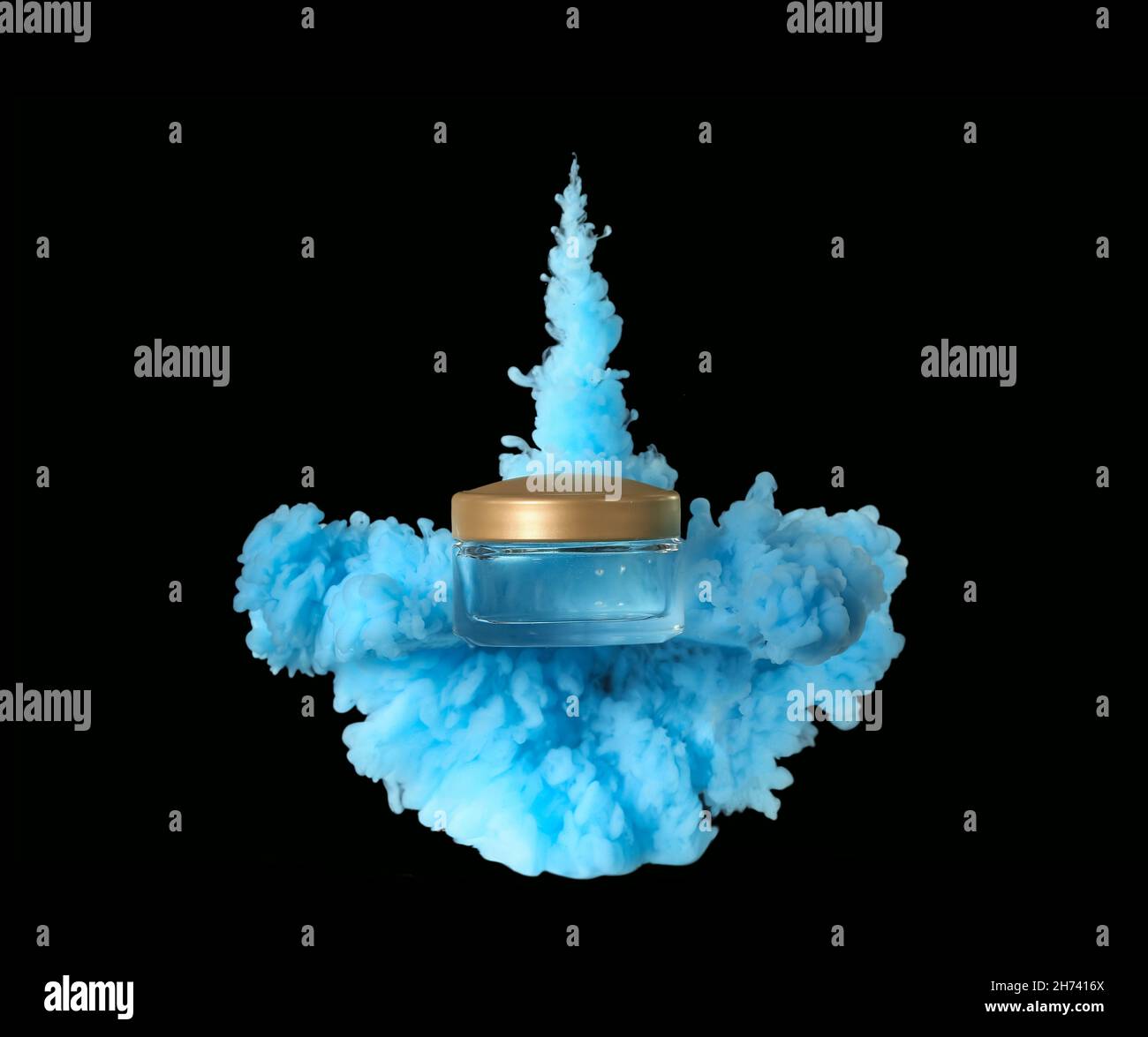 Jar of cosmetic product in blue smoke on black background Stock Photo ...