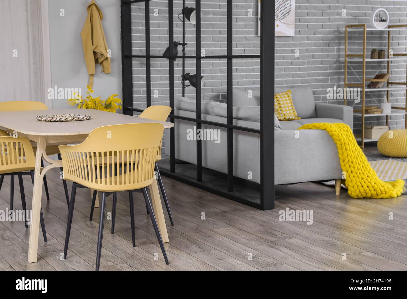 Modern studio apartment with dining table Stock Photo - Alamy