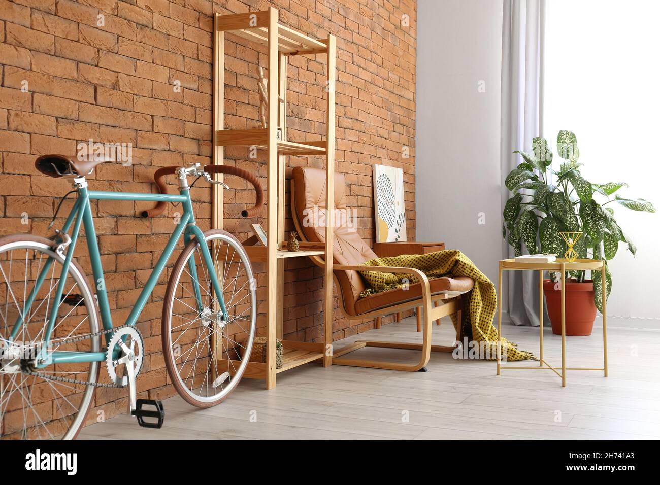Stylish interior with bicycle in room Stock Photo - Alamy