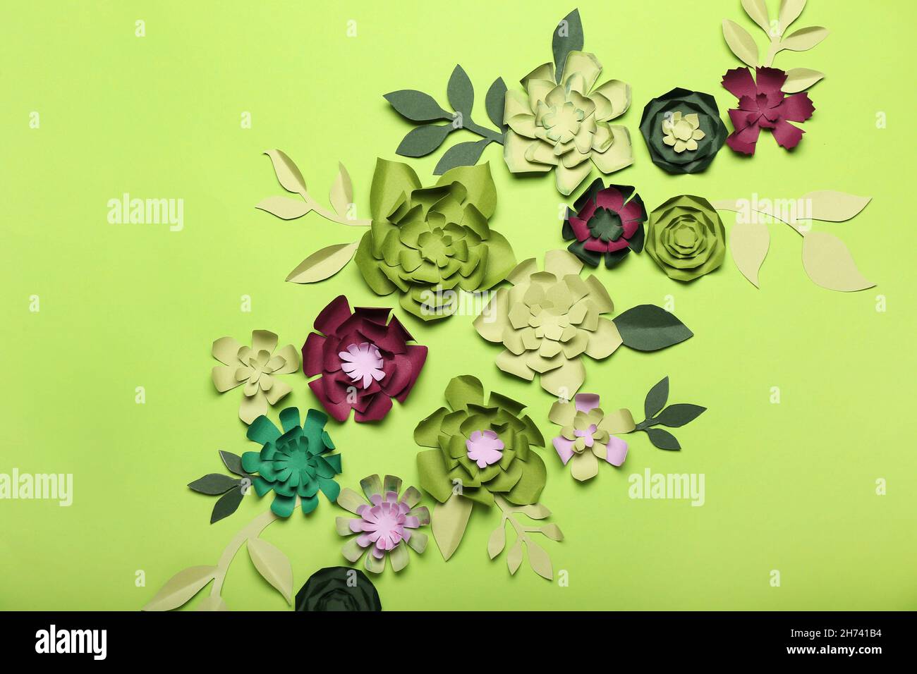 Beautiful handmade paper flowers on color background Stock Photo - Alamy