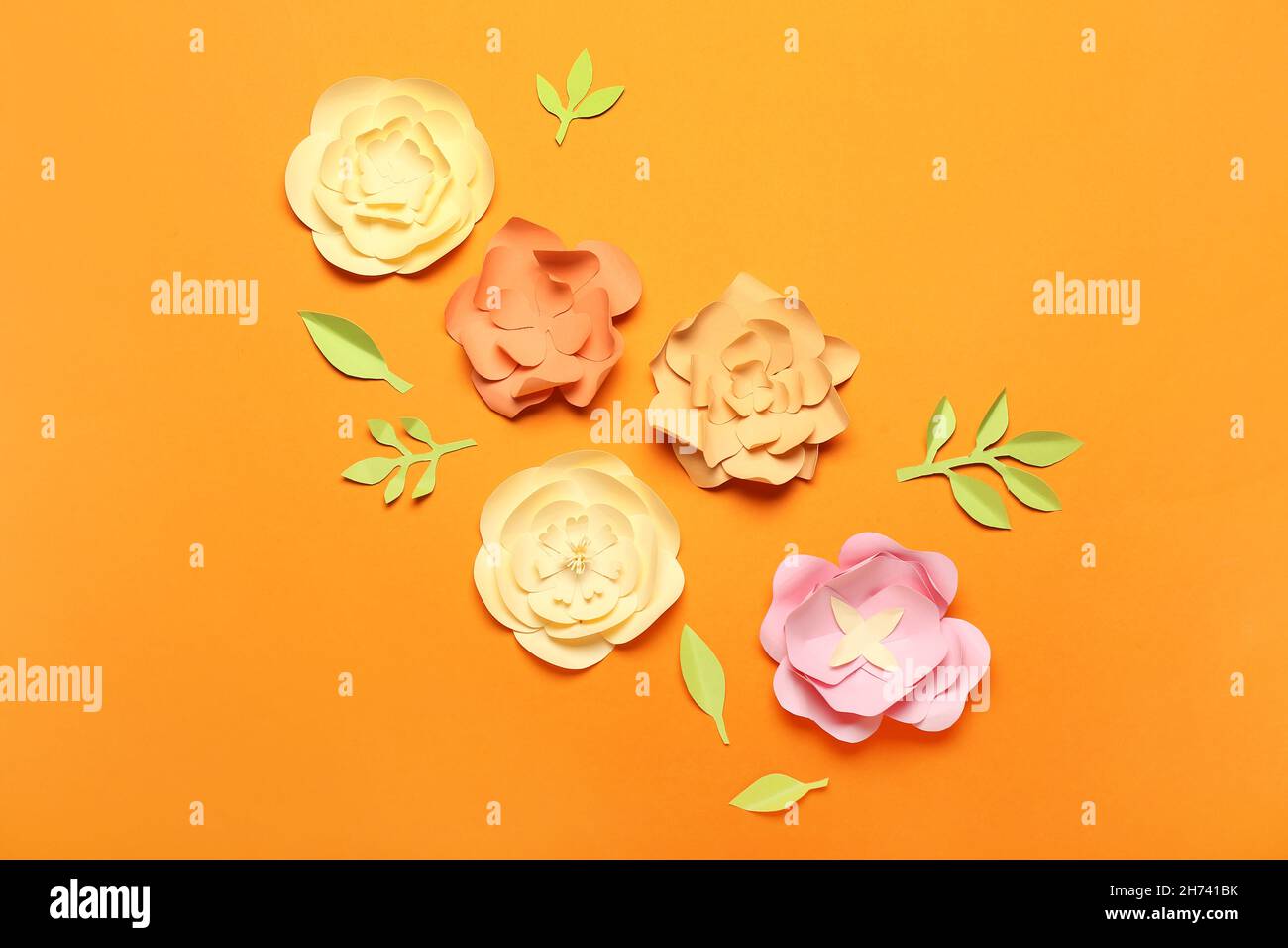 Beautiful handmade paper flowers on color background Stock Photo - Alamy