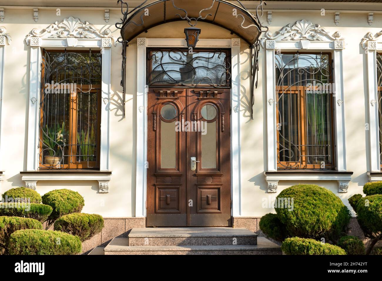 Closed doors of beautiful old building on city street Stock Photo - Alamy