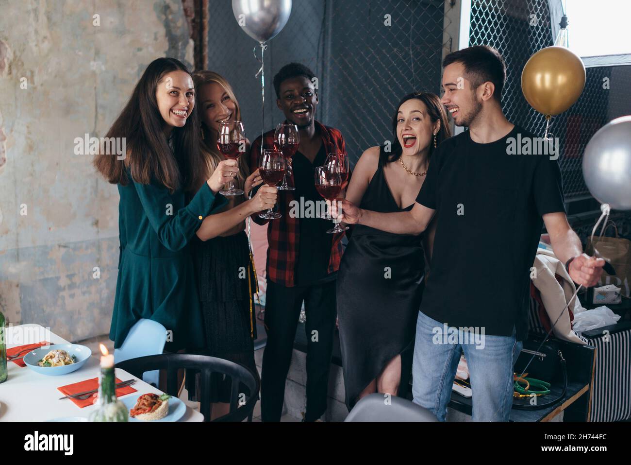 Group of friends celebrating in the bar Stock Photo - Alamy