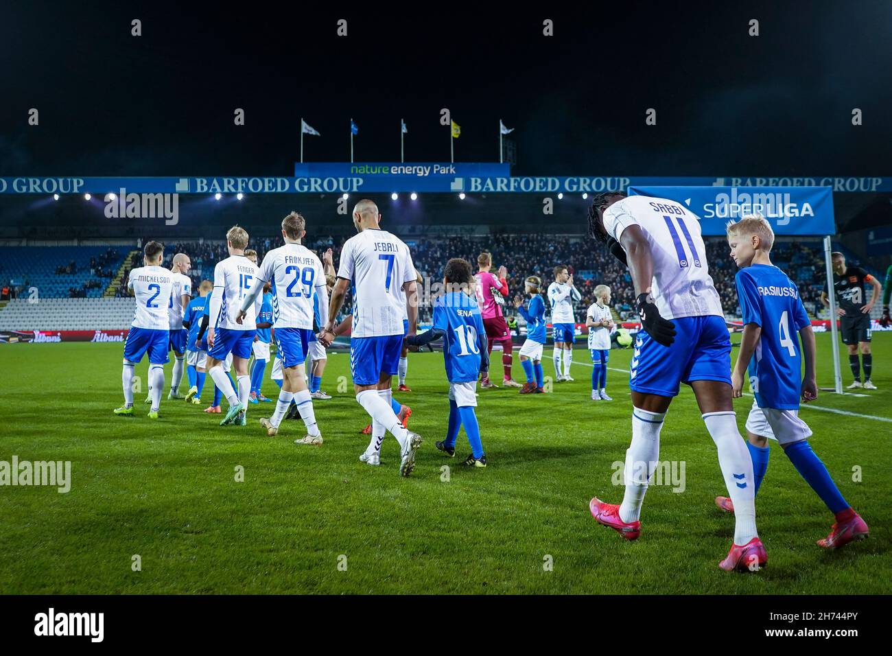 Odense, Denmark. 19th Nov, 2021. The players of OB enter the pitch for ...