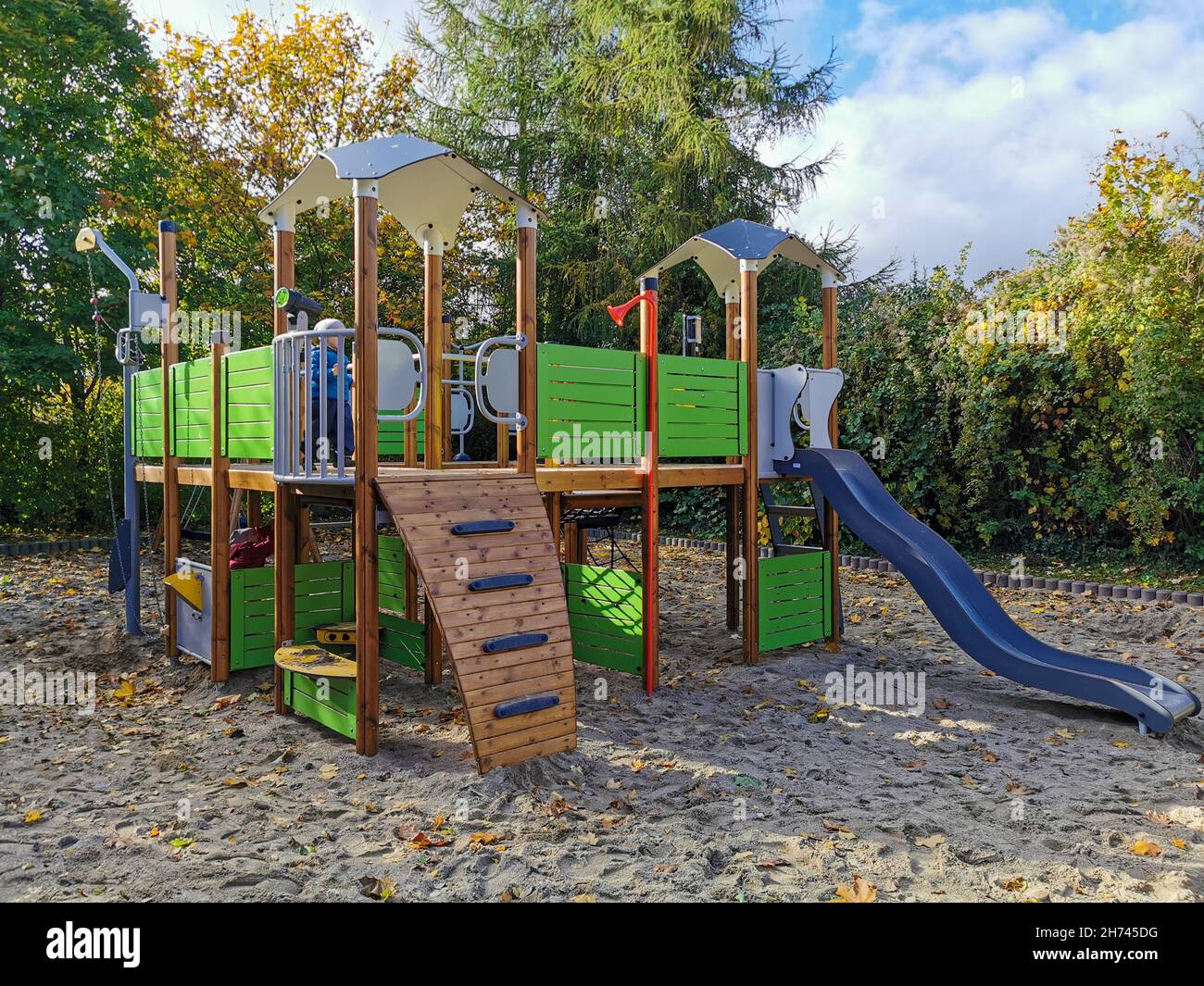 Closeup of a playground against forest trees Stock Photo - Alamy