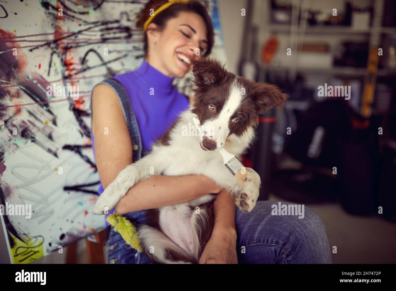 A young female artist having a good time in a pleasant atmosphere in ...