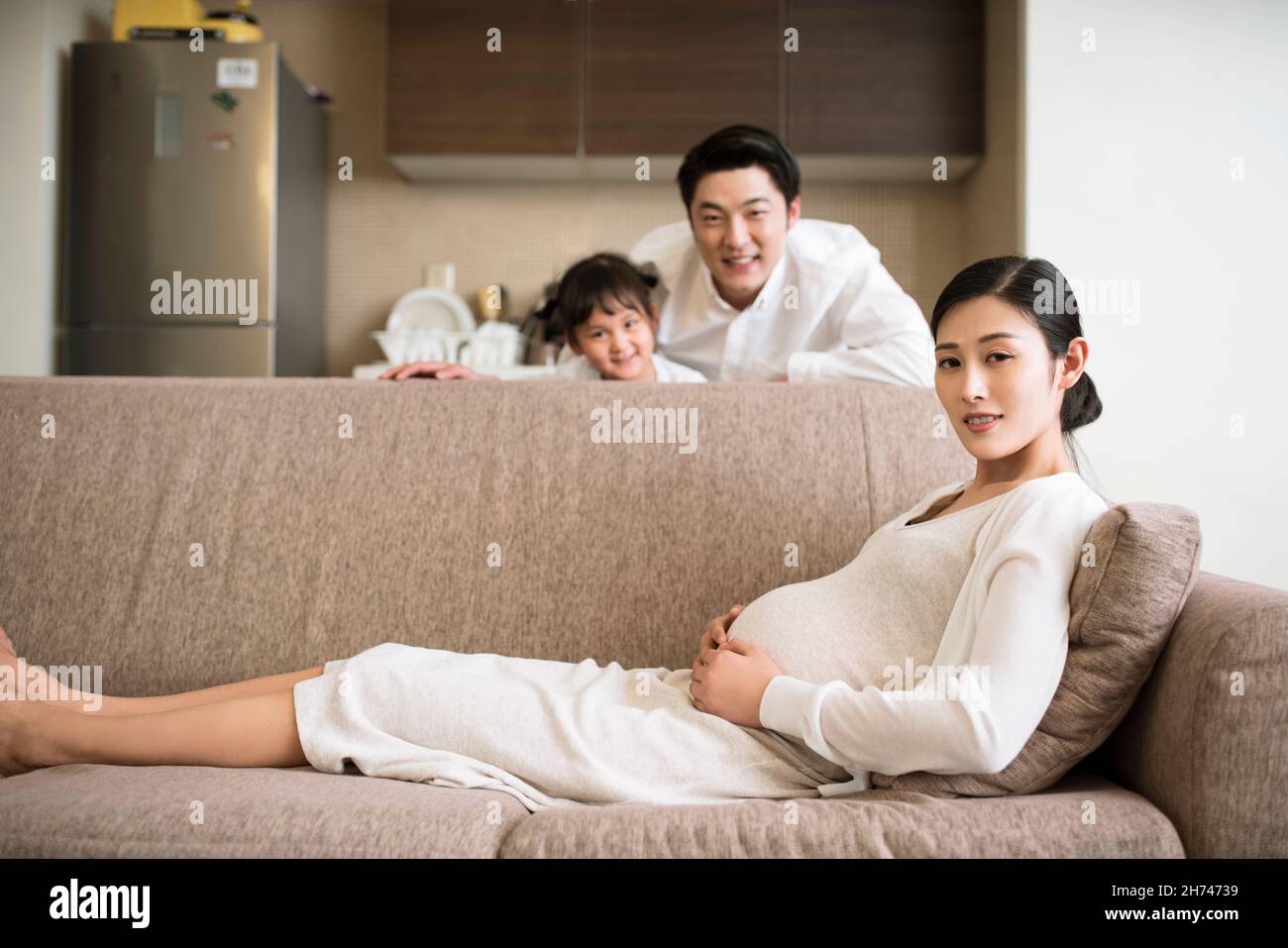 Happy and loving family of three Stock Photo - Alamy
