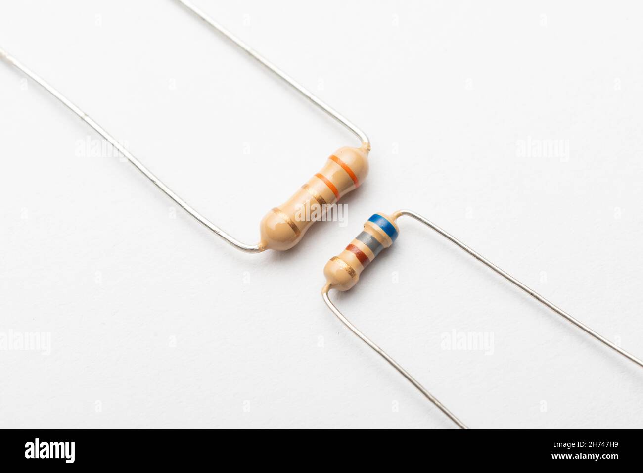 0.5w and 0.25w resistors in comparison on a white background Stock ...