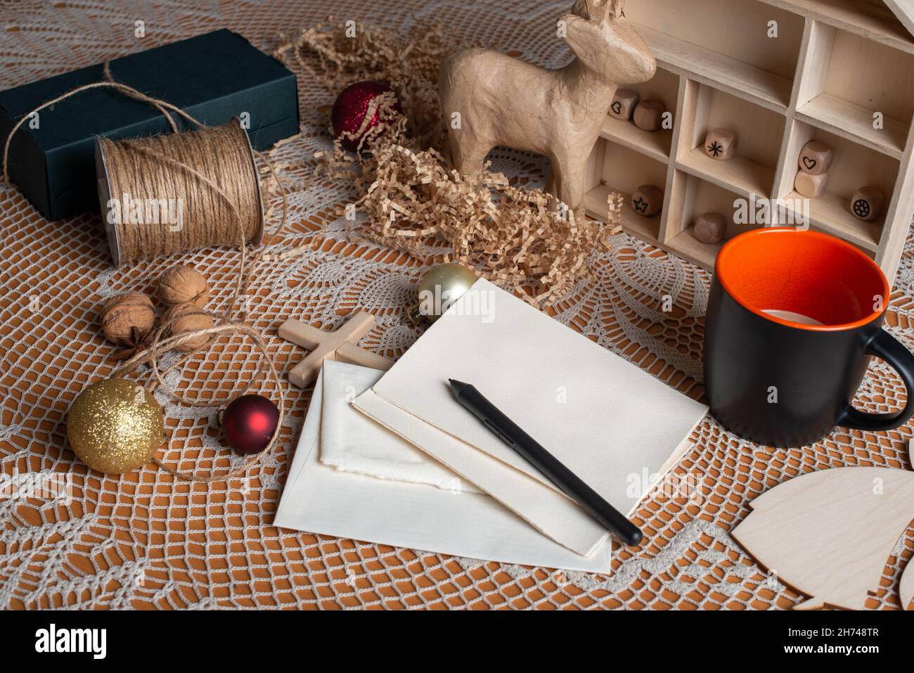 Preparation for Christmas holidays. Table with decorations, cup of ...