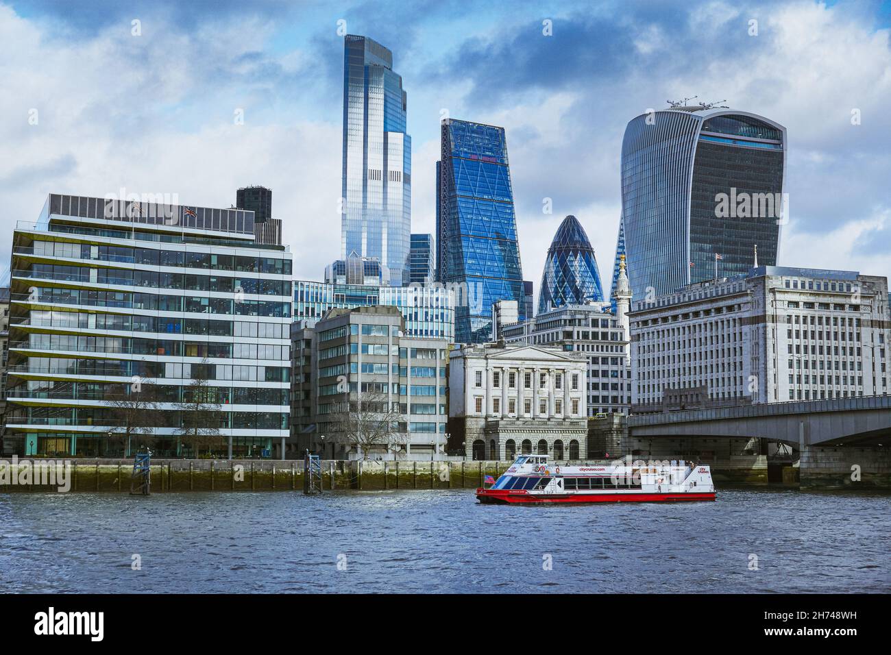 Cold winter view of the Thames near London Bridge, with landmarks such ...