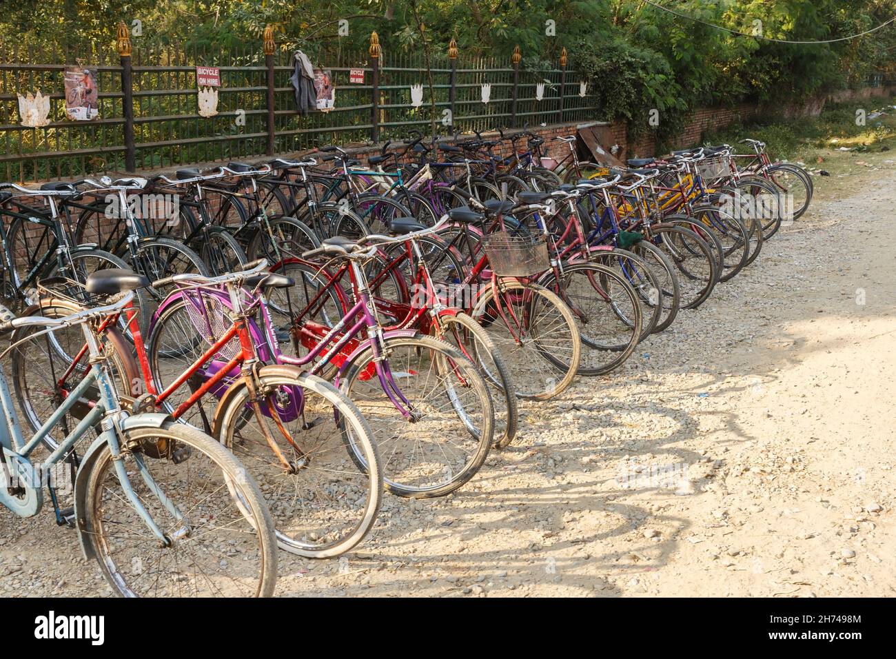 Lumbini, Nepal - November 17, 2016: Bicycle parking near the park on ... Lumbini, Nepal - November 17, 2016: Bicycle parking near the park on ...
