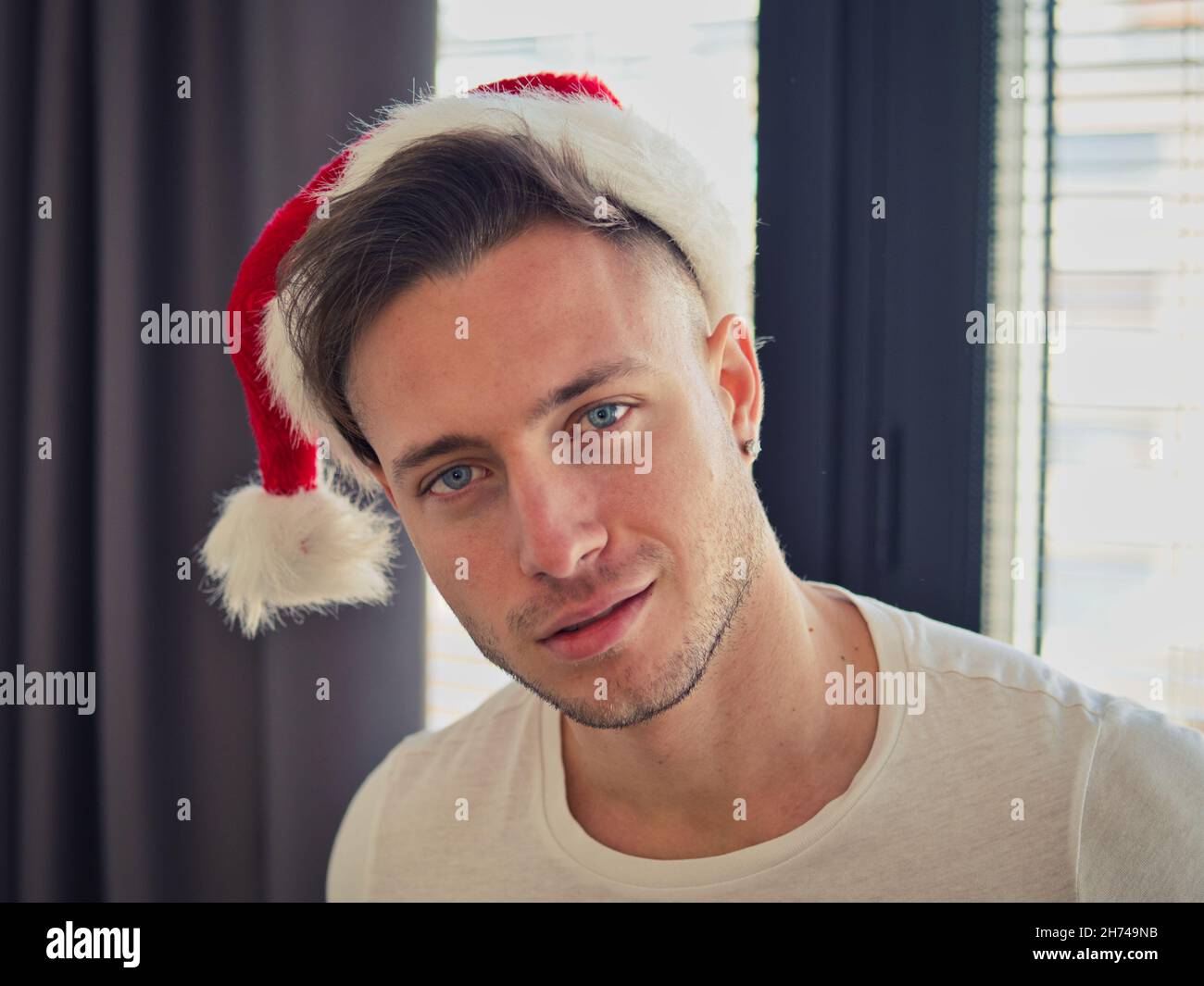 Portrait man santa hat hi-res stock photography and images - Alamy