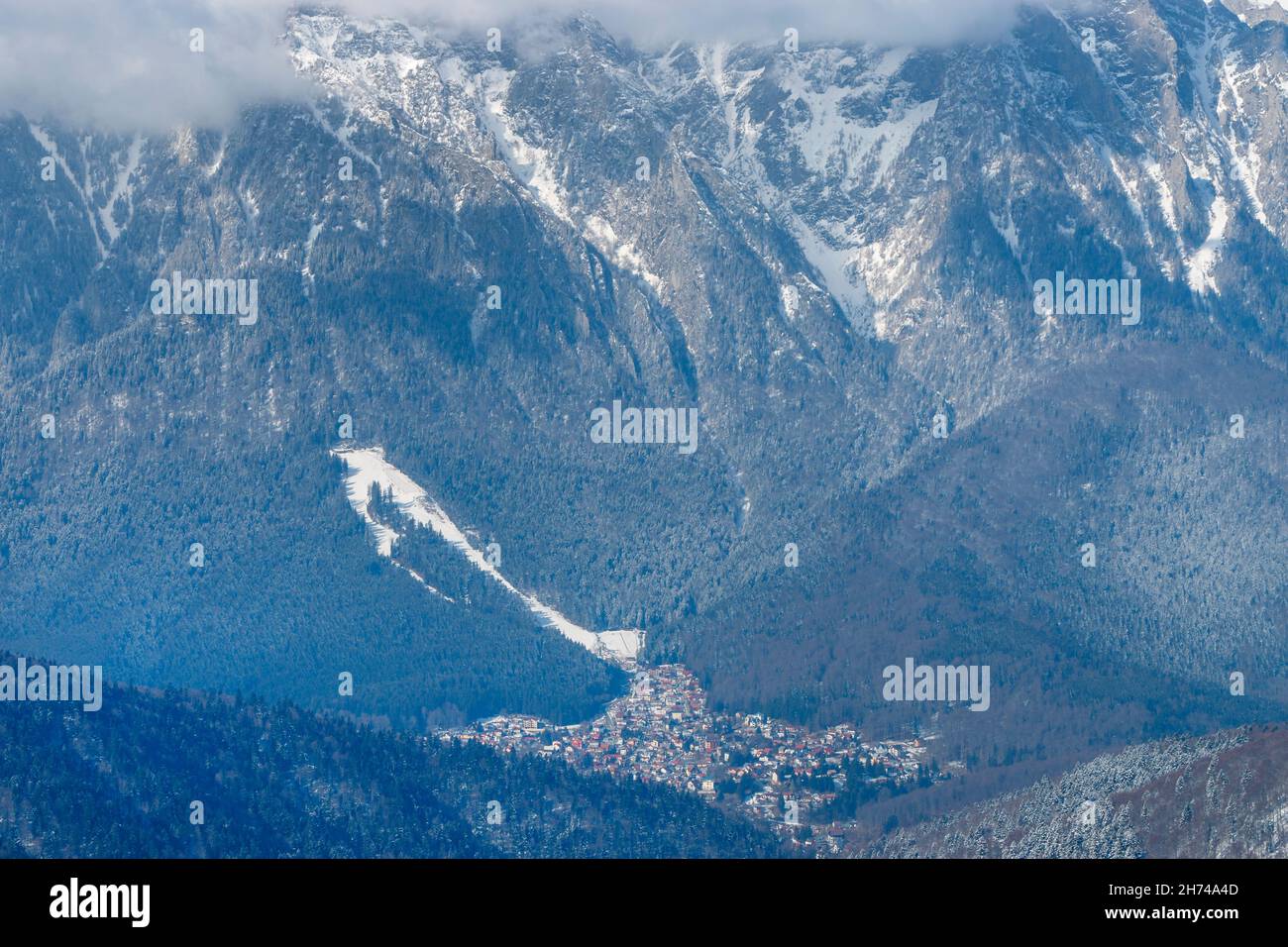 Winter aerial view of the city bellow the big mountain slope Stock ...