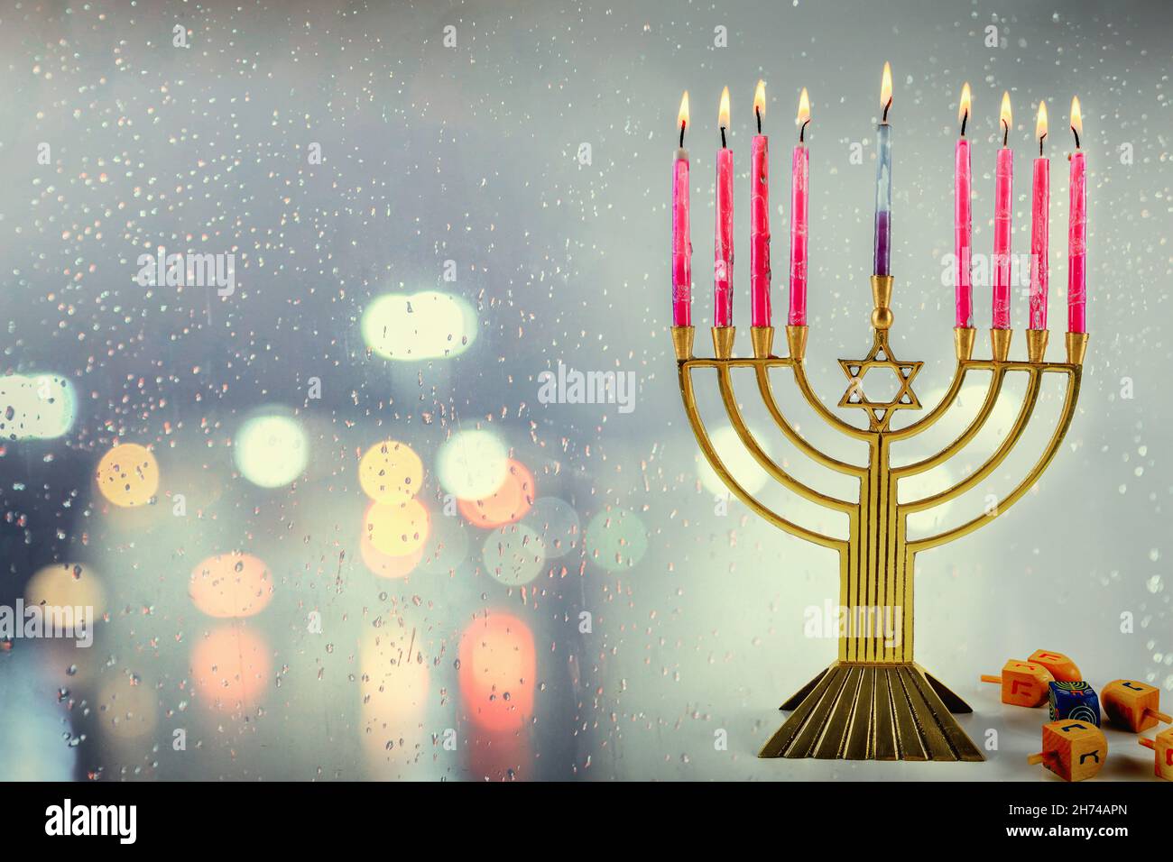 Jewish holiday hanukkah symbols menorah with copy space soft boke background Stock Photo - Alamy