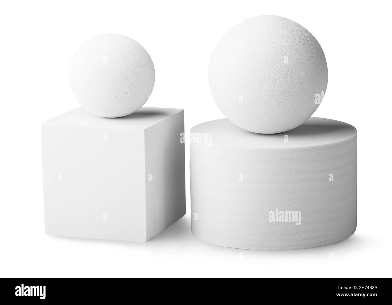 White cylinder, two balls and a square isolated on white background ...