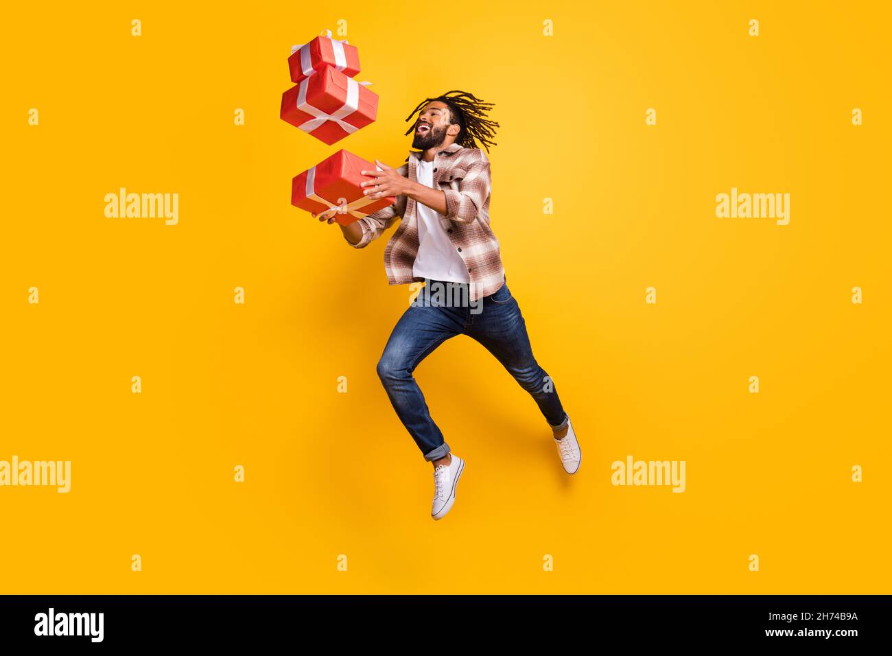 Full length body size view of nice cheerful guy jumping throw drop ...