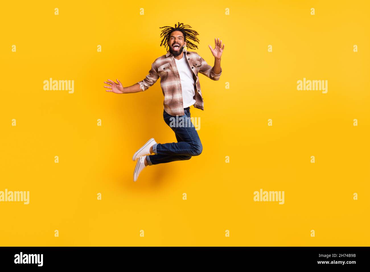 Full length body size photo of man jumping high wearing casual clothes ...