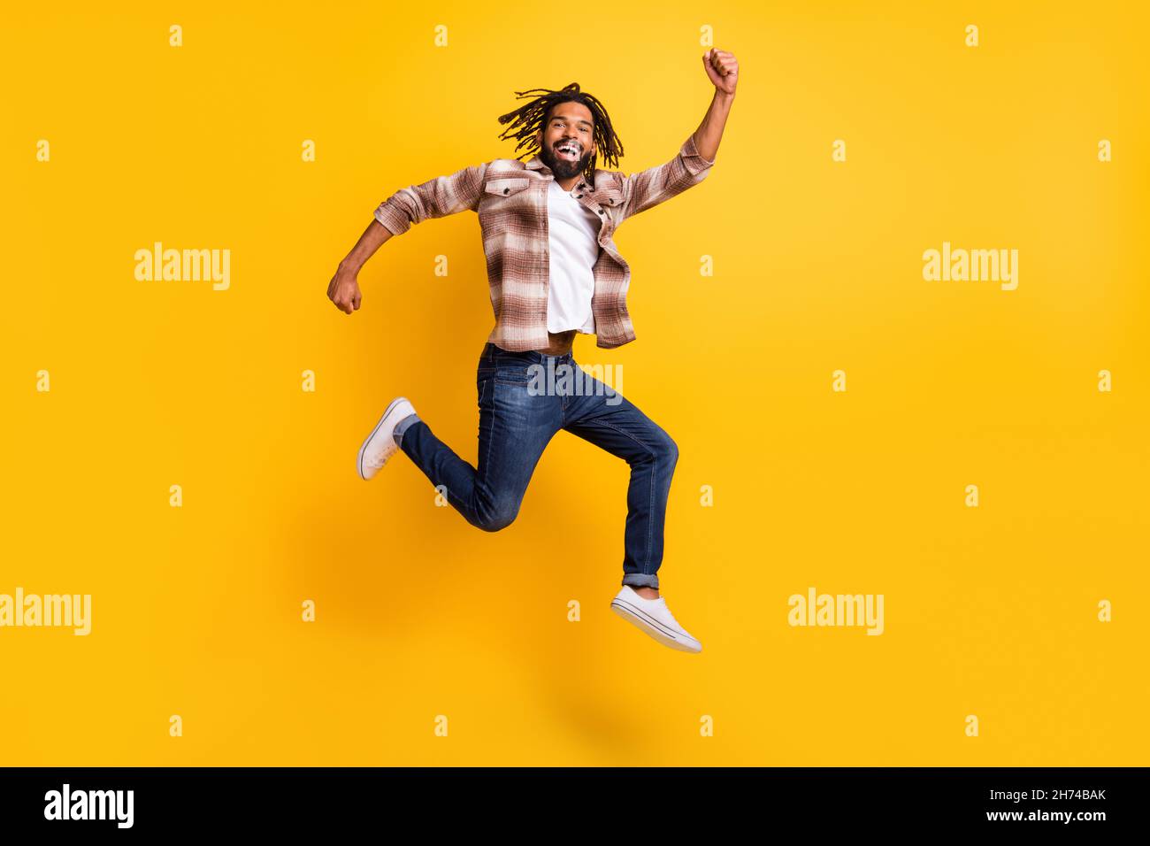 Full length body size photo of cheerful jumping man gesturing like ...